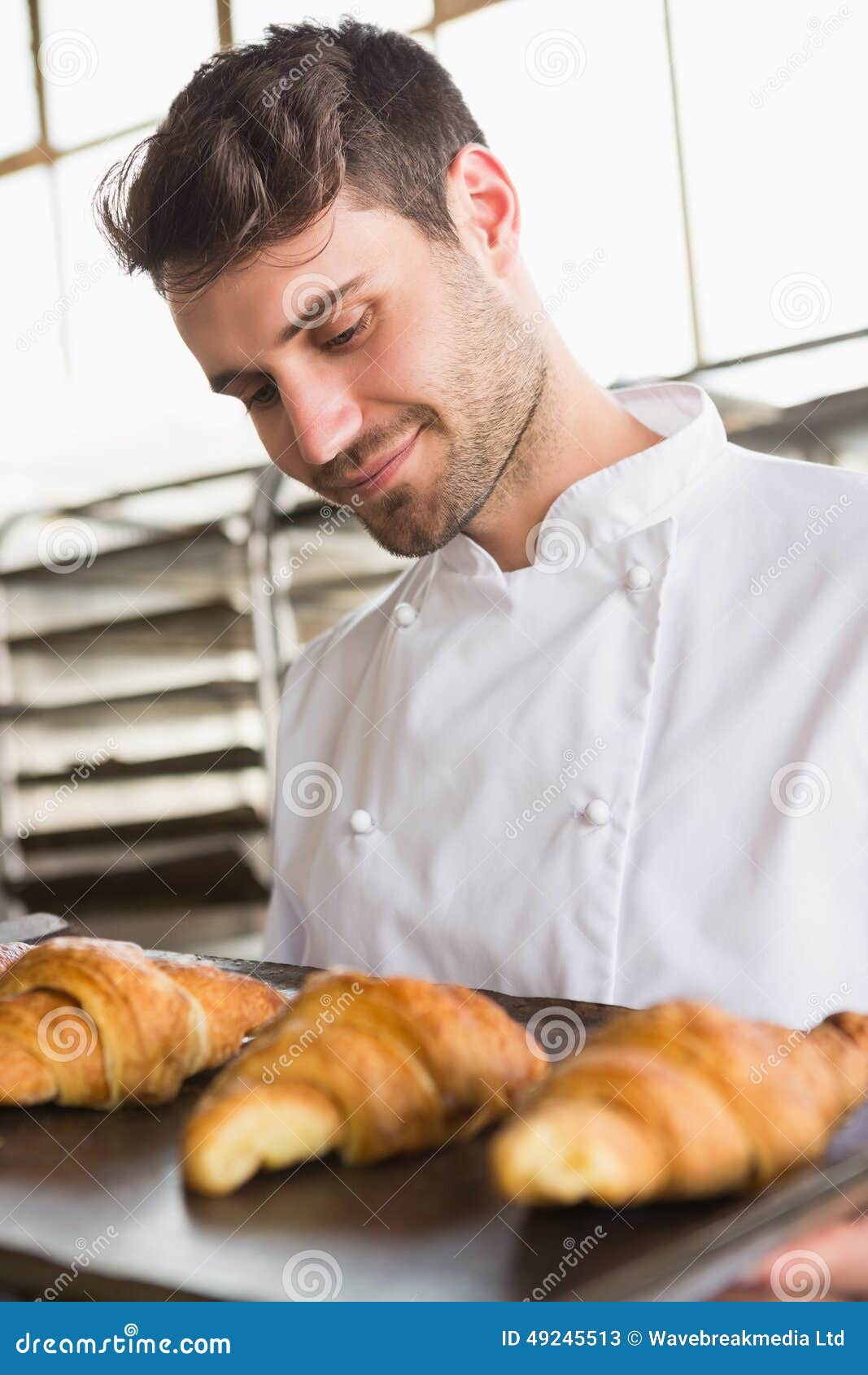 Baker Showing Tray of Fresh Croissant Stock Image - Image of ...