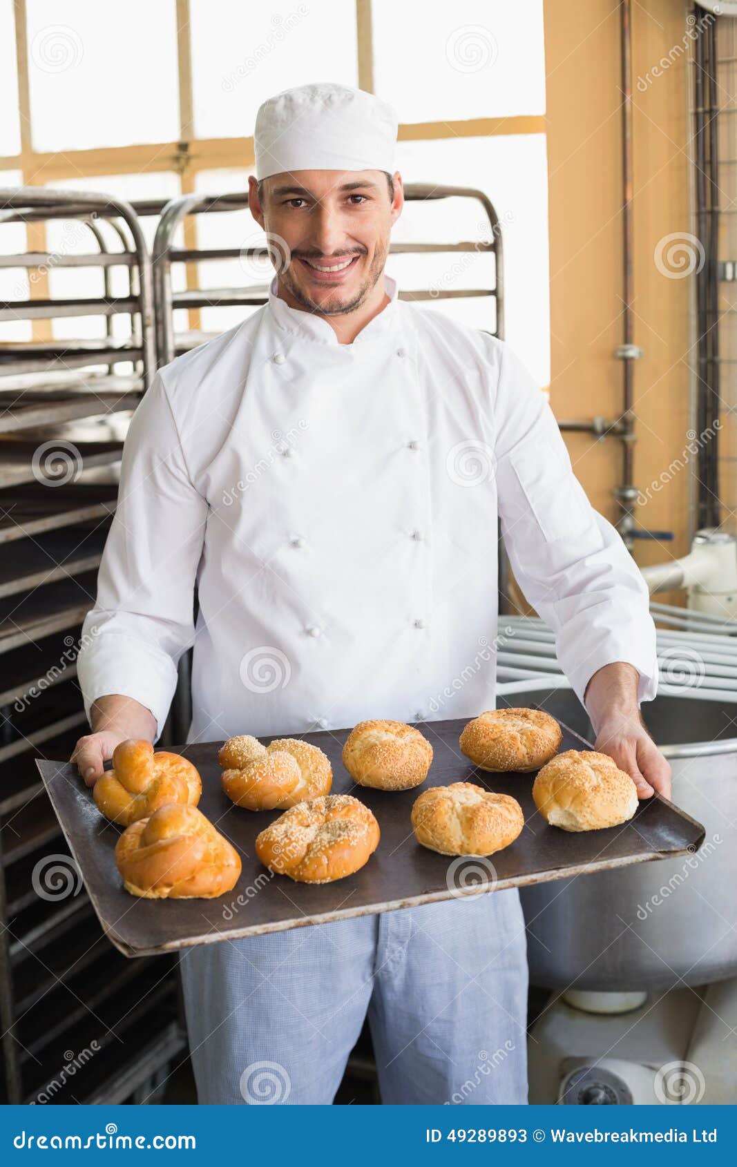 Baker Showing Tray of Rolls Stock Image - Image of industrial ...