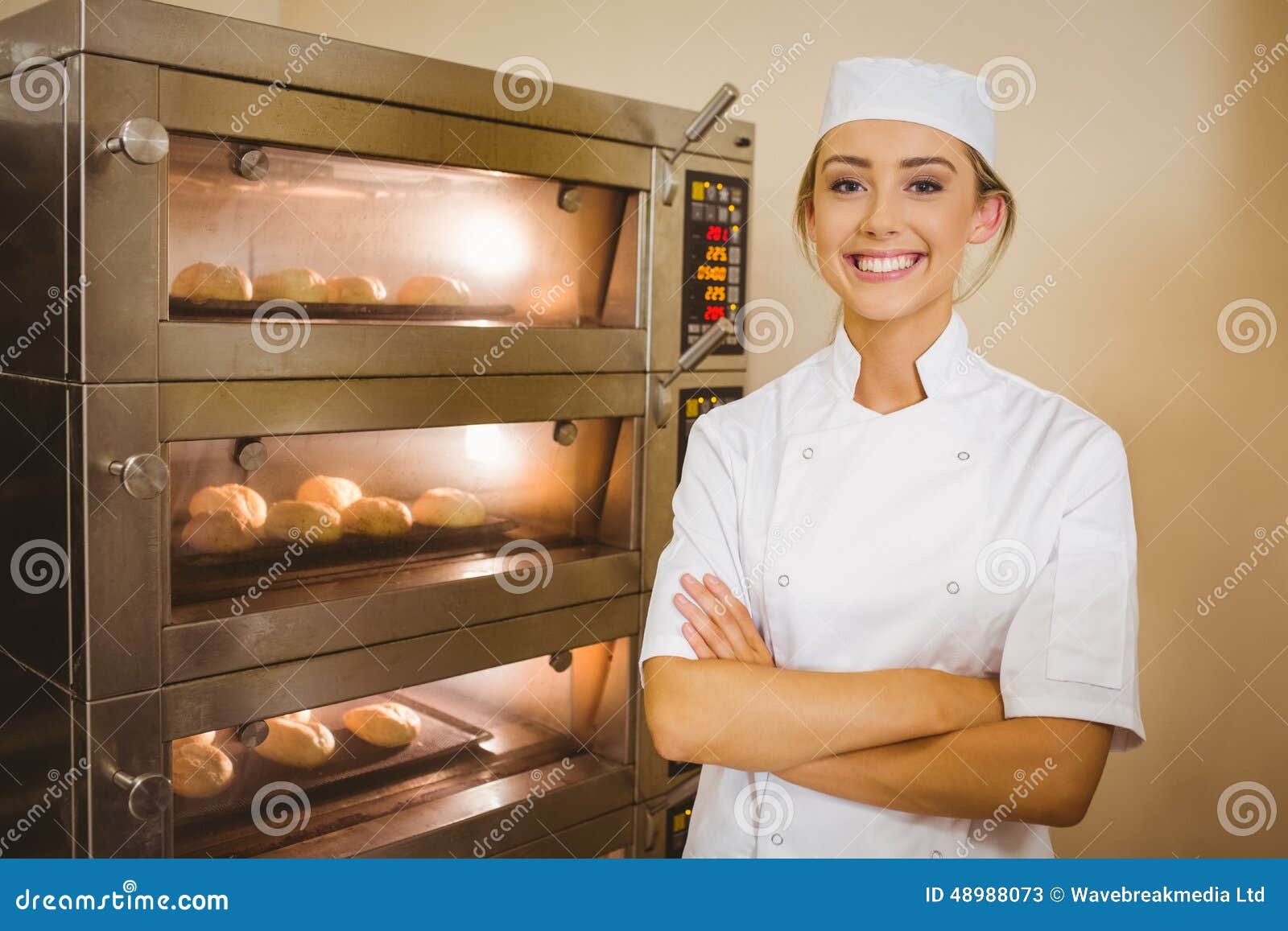 Baker Smiling at Camera beside Oven Stock Image - Image of looking ...