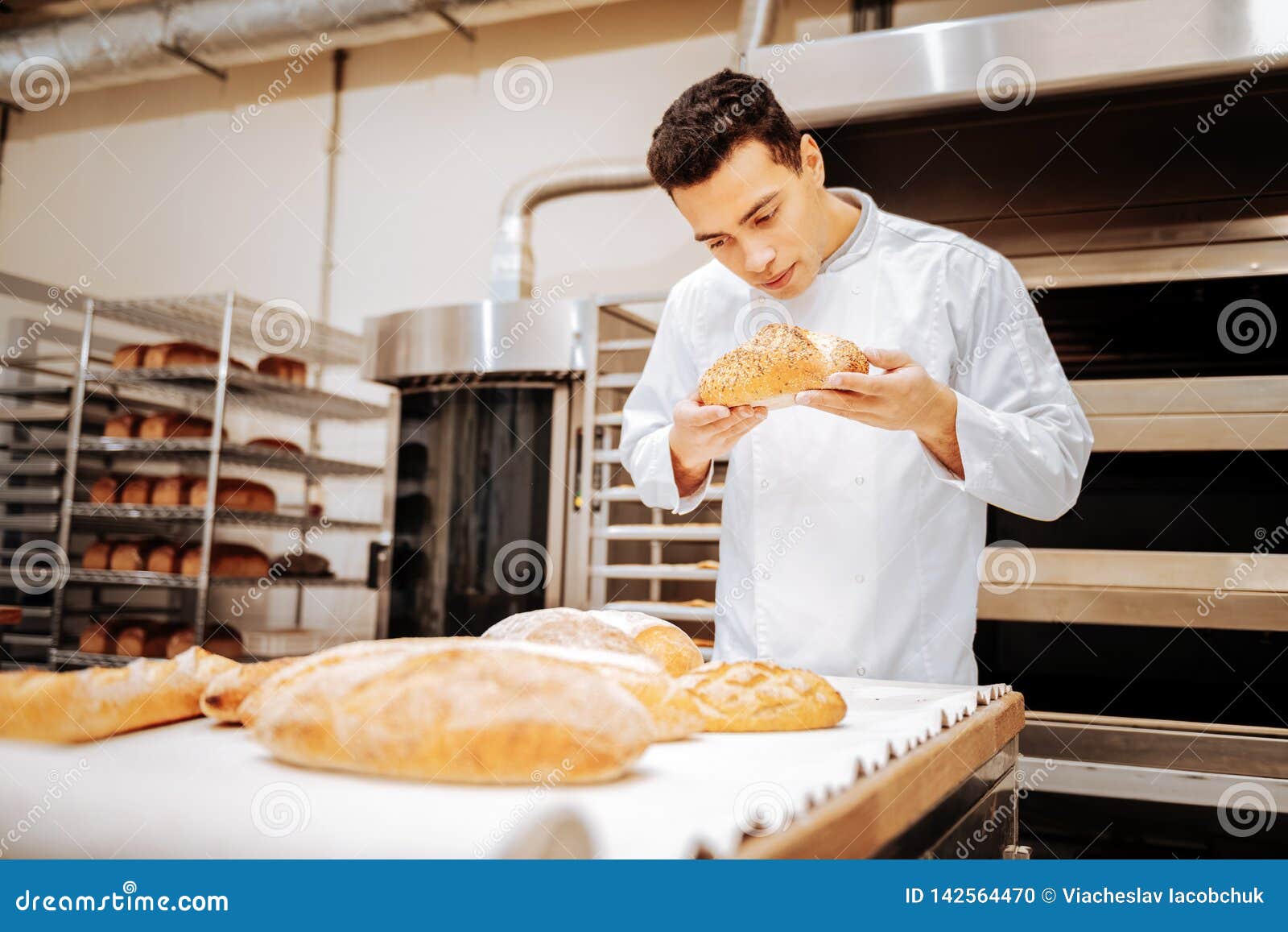 Baker Standing Near Table Checking the Quality of Bread Stock Photo ...