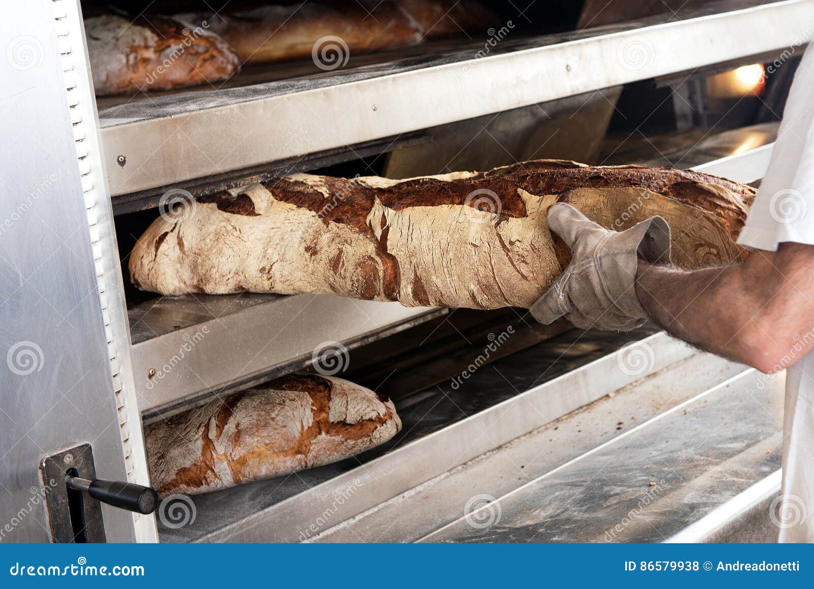 Baker Taking Large Loaf of Bread Out Stock Photo - Image of bread ...