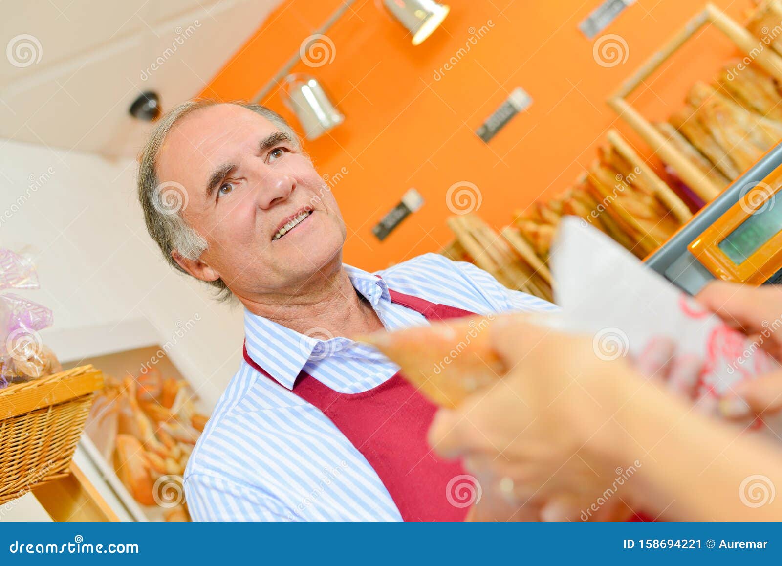 Baker talking to customer stock image. Image of apron - 158694221