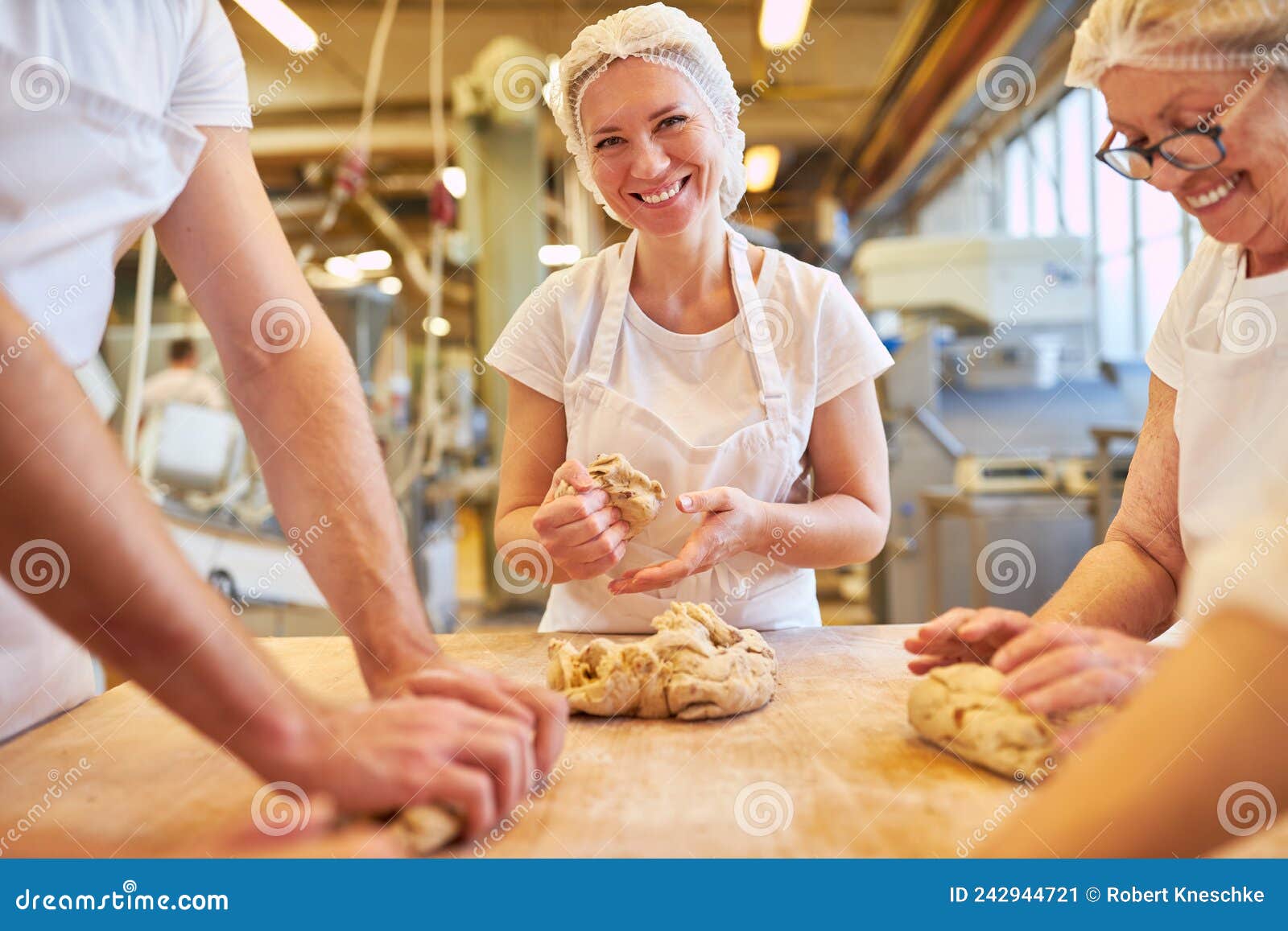 Baker Team with Apprentice Kneading Dough for Baking Stock Image ...