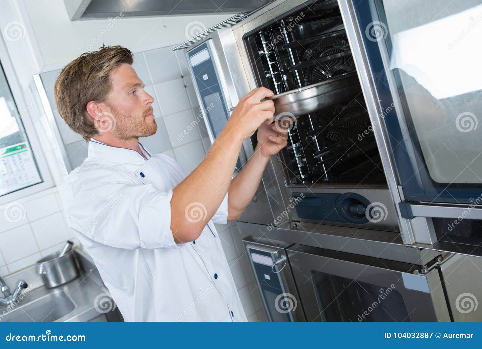 Baker Using Oven in Kitchen Bakery Stock Image - Image of chefs, bread ...