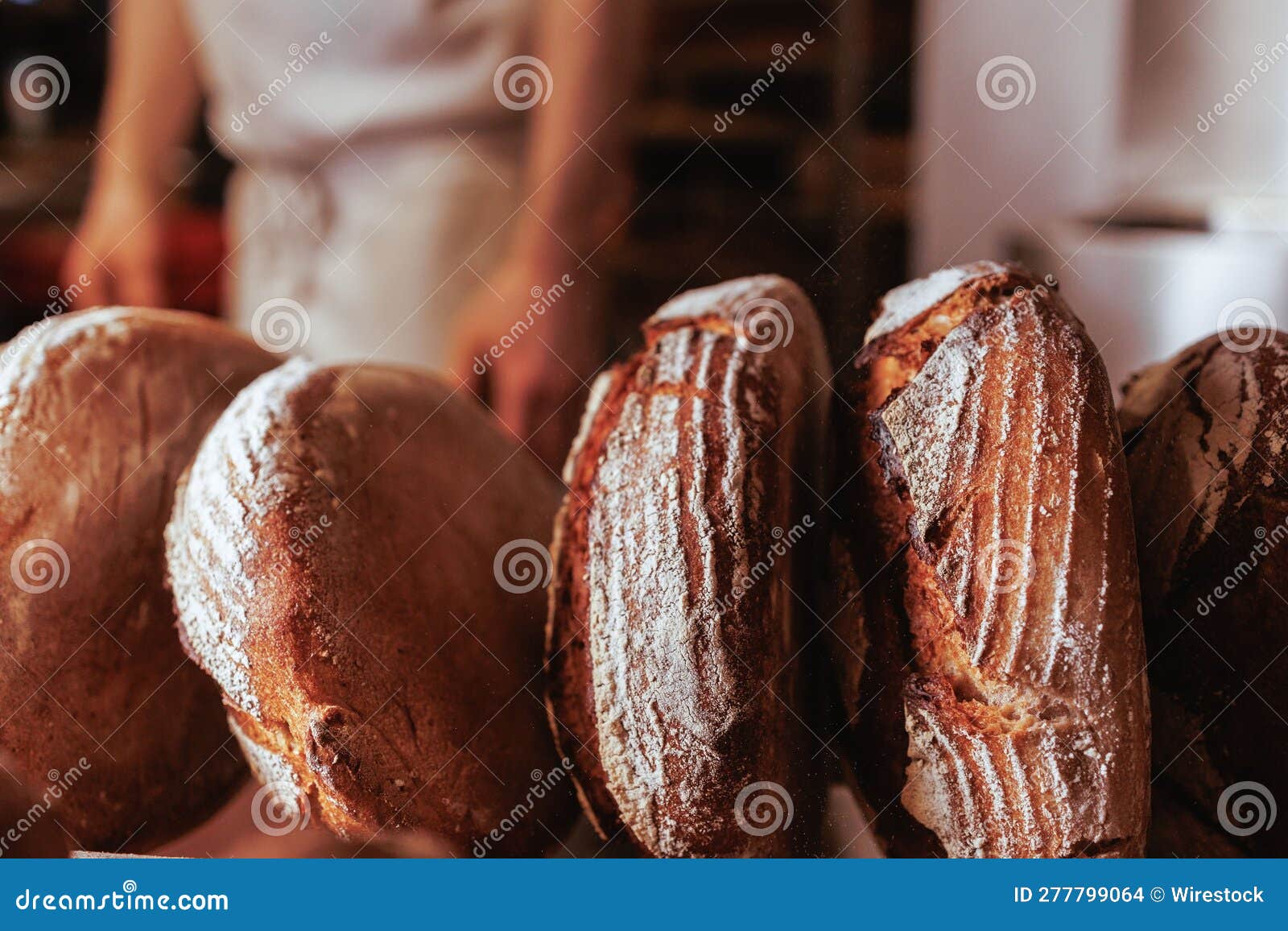 Baker Working in the Kitchen, Preparing Loaves of Bread Stock Photo ...