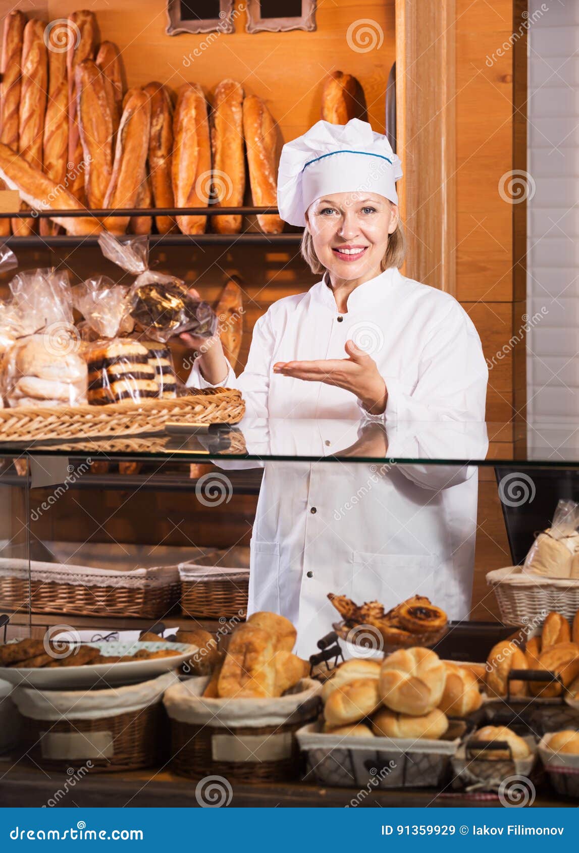 Bakery Employee Offering Bread Stock Image - Image of loaves, pastry ...