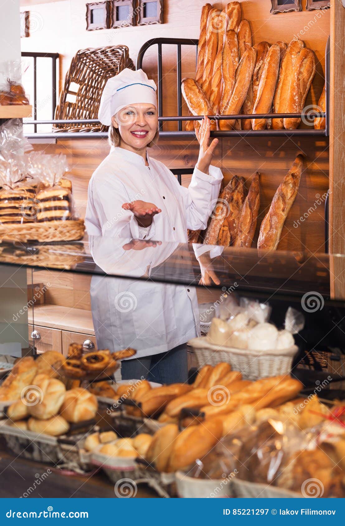 Bakery Employee Offering Bread Stock Image - Image of bread, fresh ...