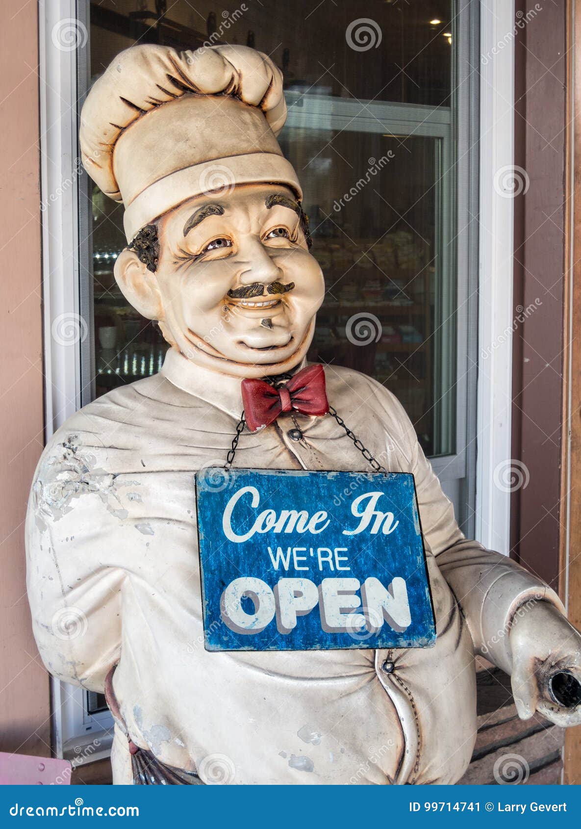 Bakery sidewalk statue stock image. Image of america - 99714741