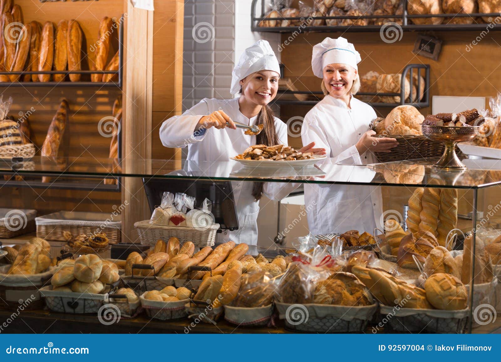 Bakery Staff Offering Bread Stock Photo - Image of coffee, female: 92597004