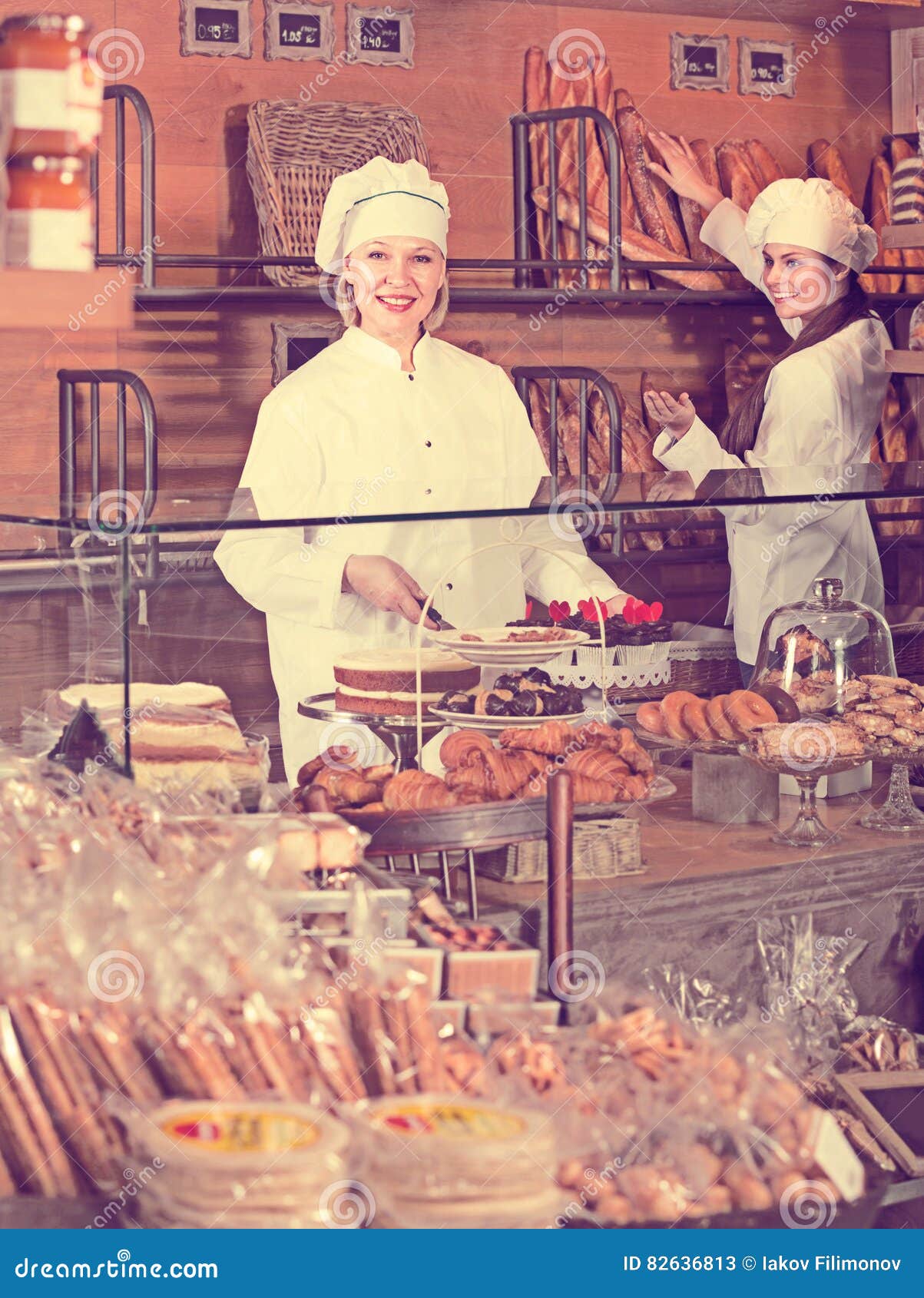 Bakery Staff Offering Bread Stock Image - Image of indoor, european ...