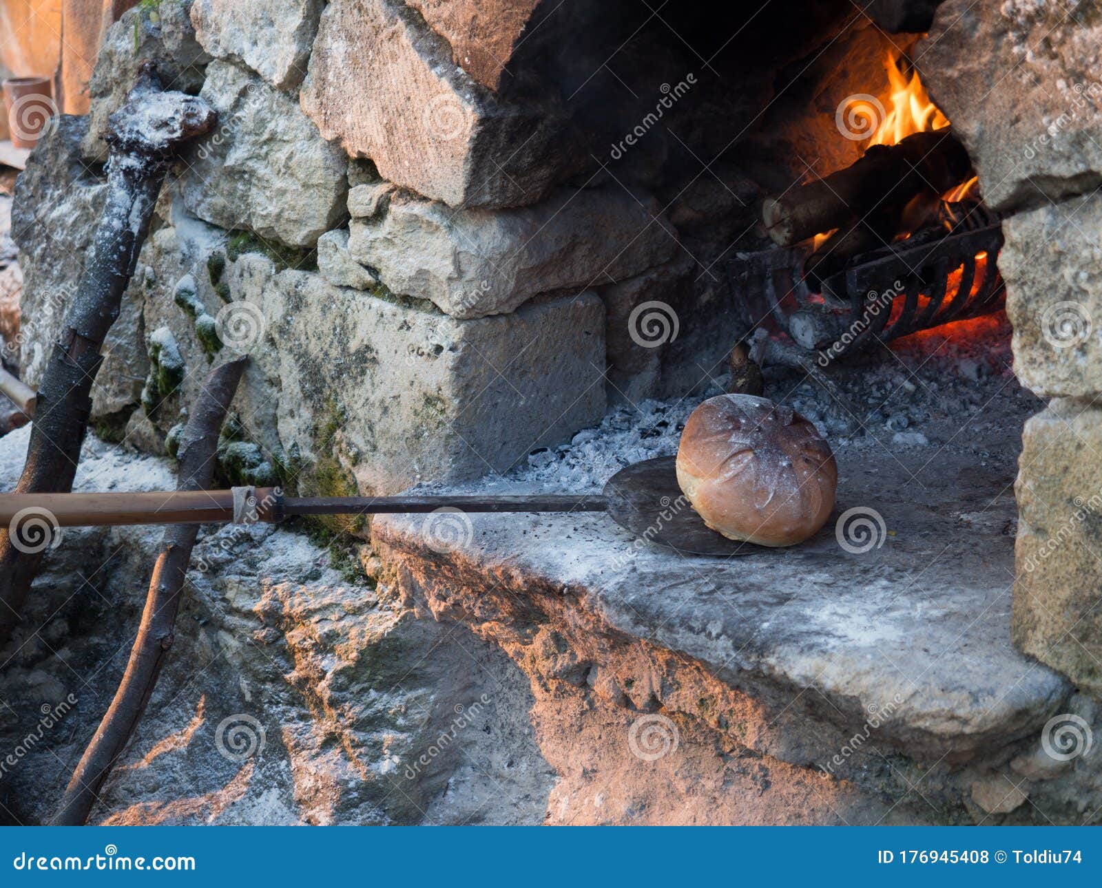 Baking Bread in a Oven Built Using Stones Stock Photo - Image of food ...