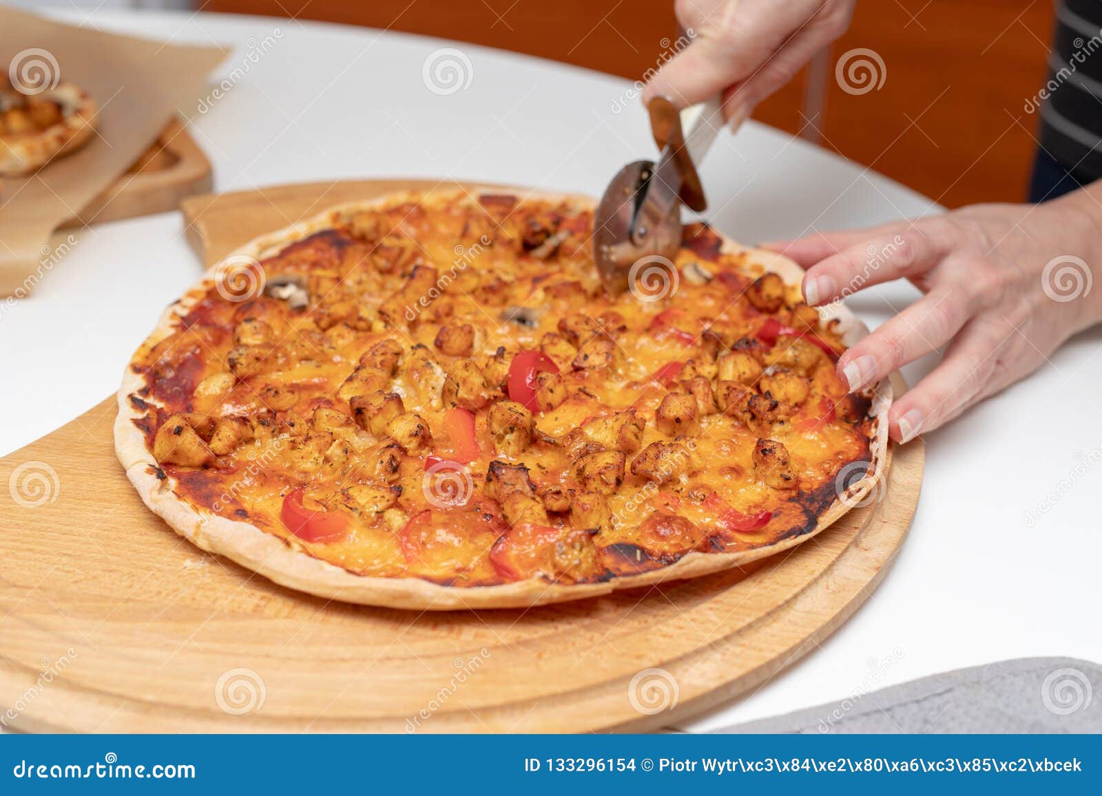 Baking a Delicious Pizza in a Home Kitchen. Slicing and Stacking Stock ...