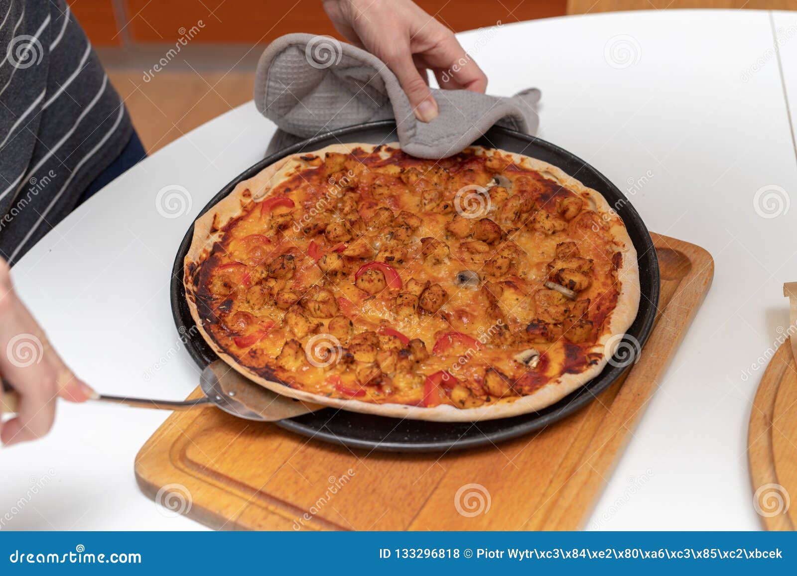 Baking a Delicious Pizza in a Home Kitchen. Slicing and Stacking Stock ...