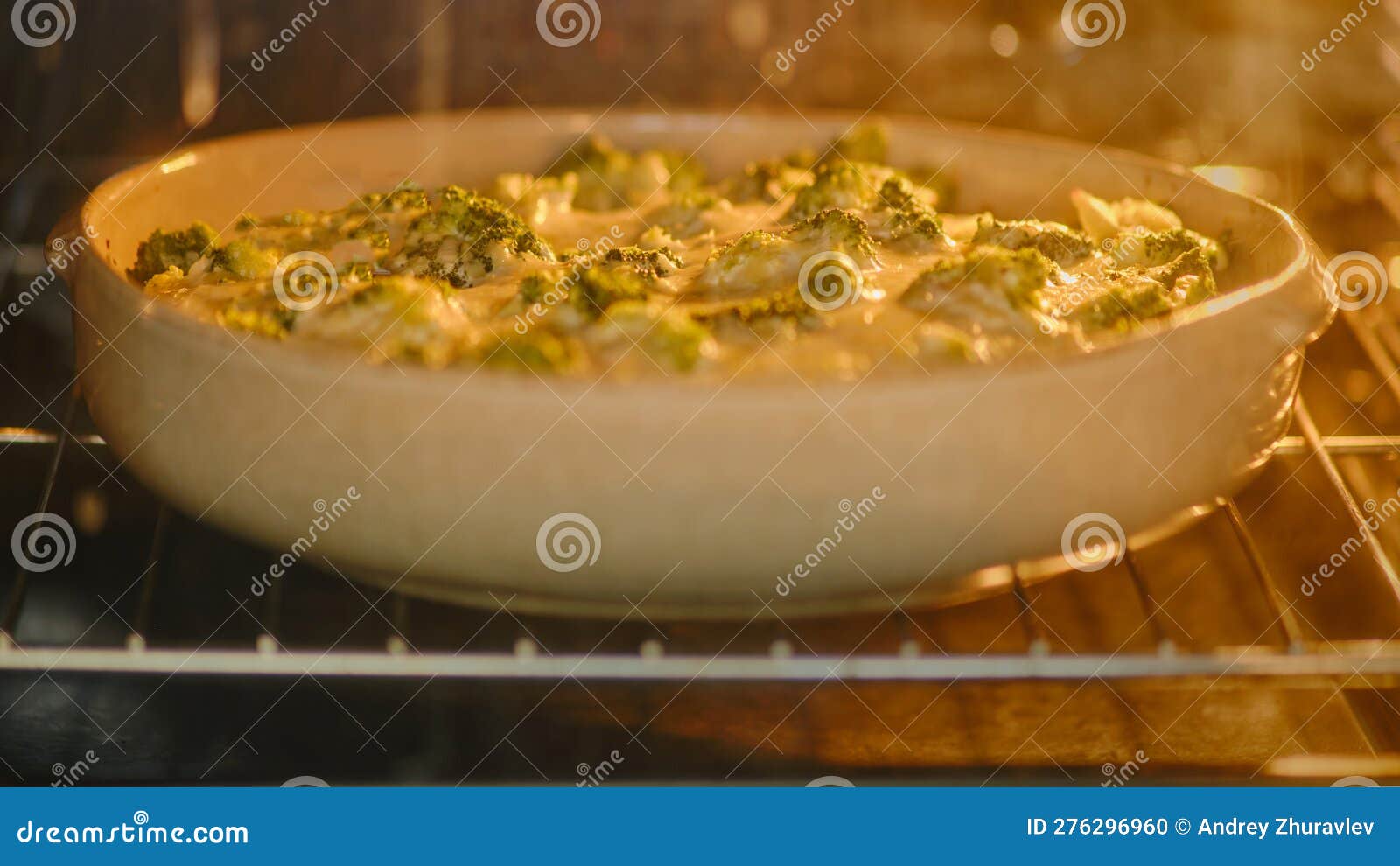 Baking Fish with Broccoli Under Cheese in the Oven Stock Photo - Image ...