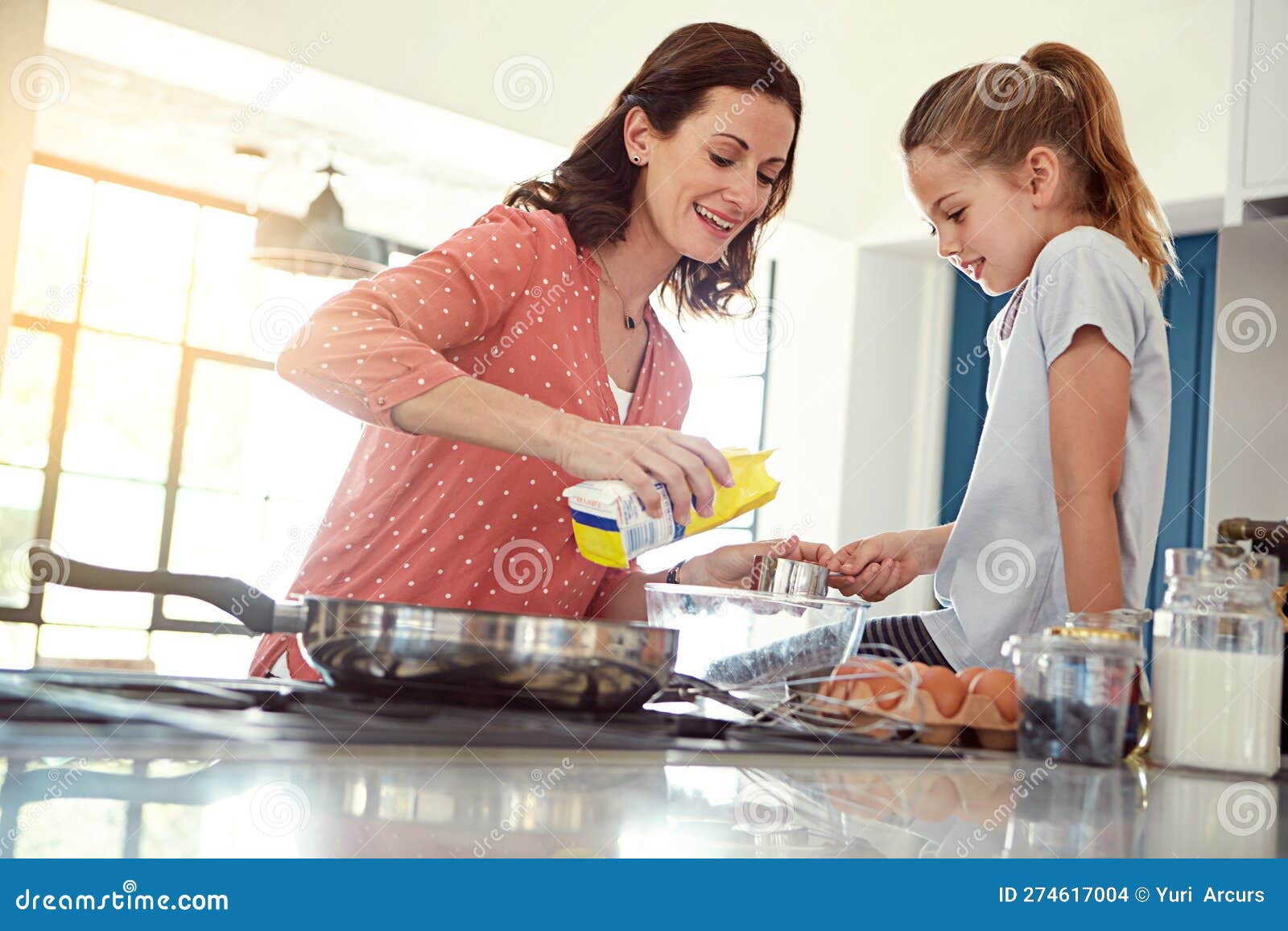Baking is a Great Way To Bond. a Mother Baking with Her Daughter in the ...