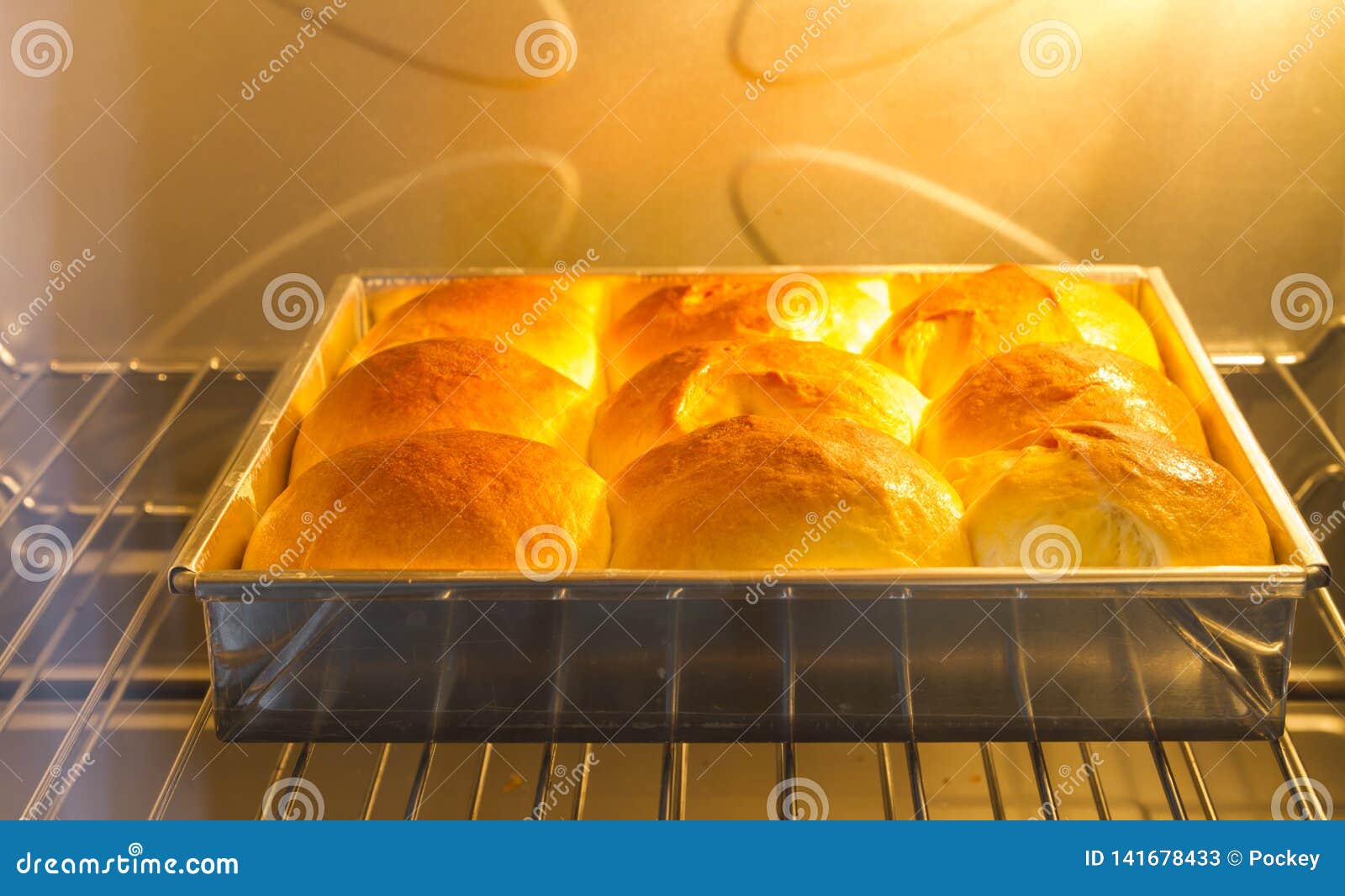 Baking a loaf of bread stock image. Image of baking - 141678433