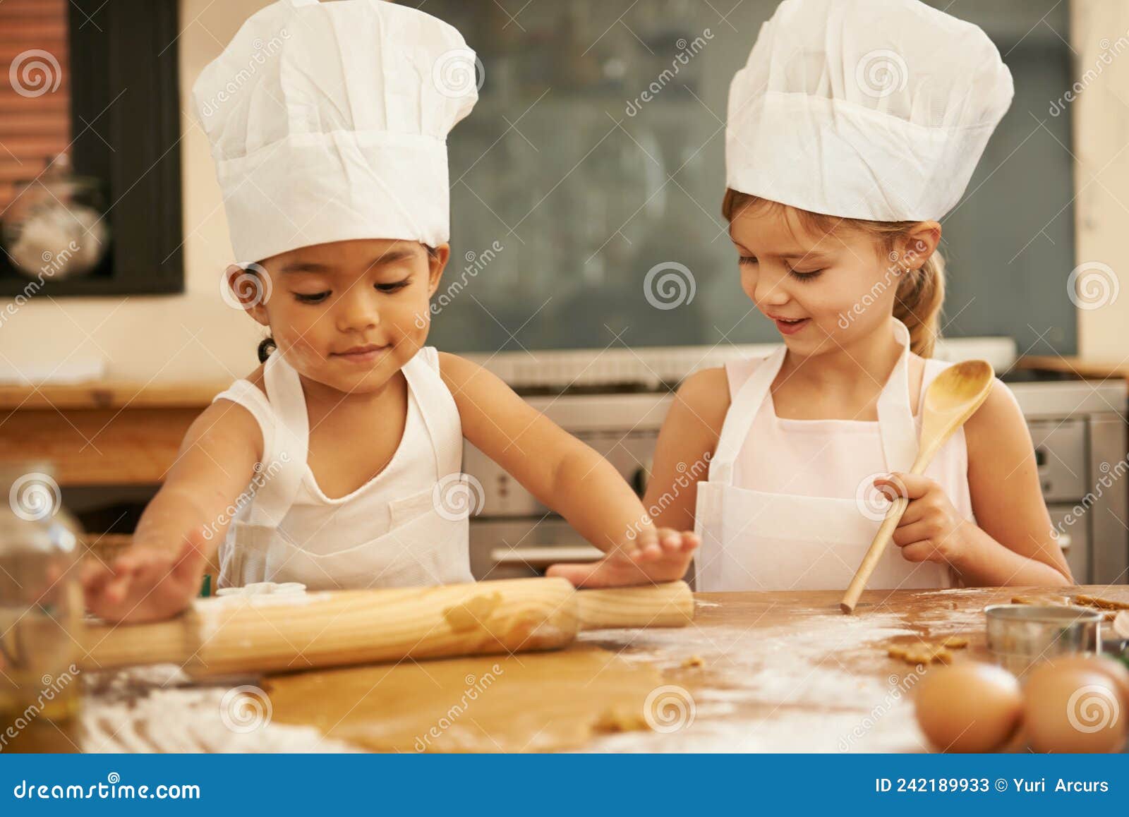 Baking is so Much Fun. Two Little Girls Baking Together in the Kitchen ...