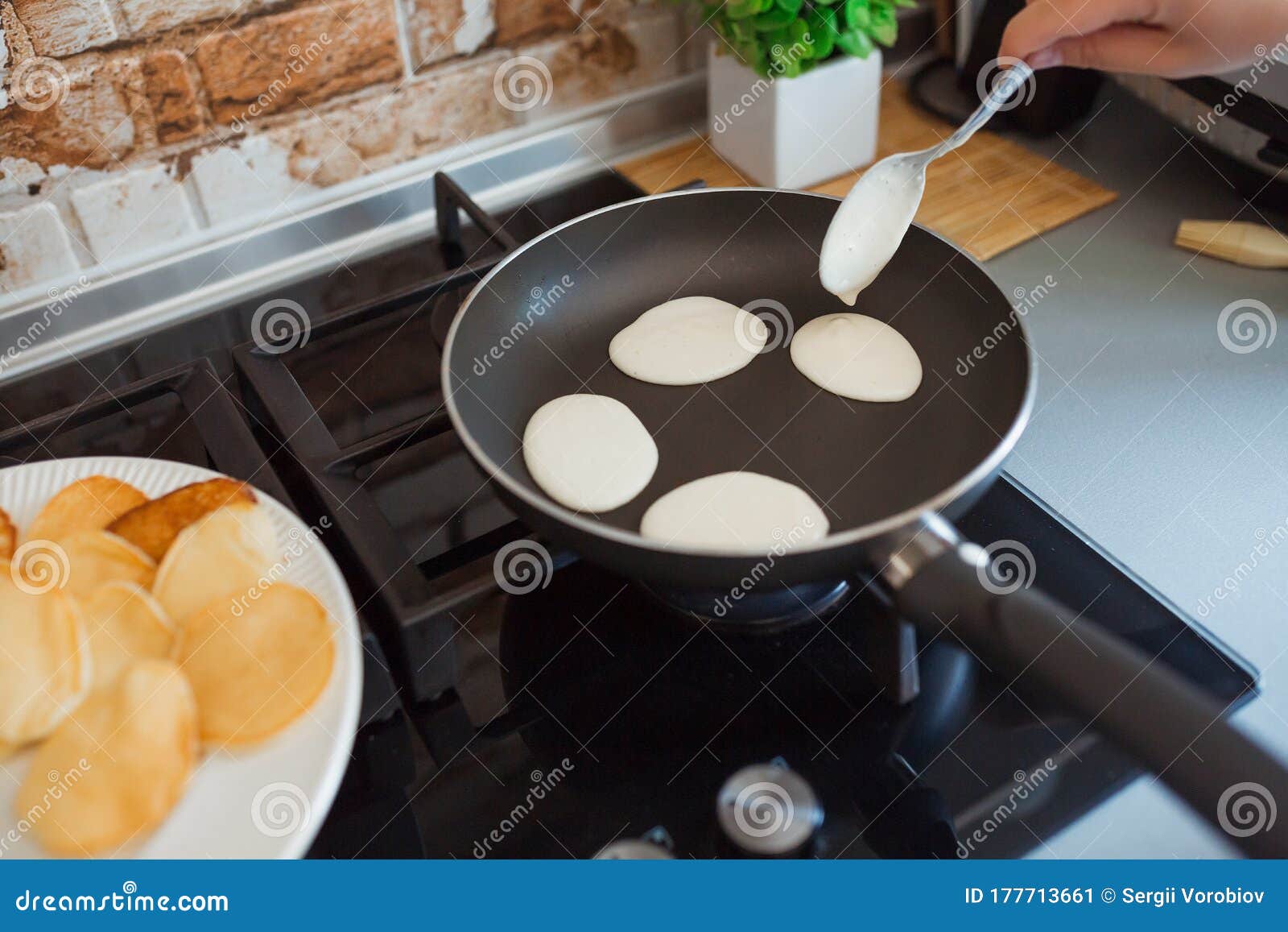 Baking Pancakes in Modern Kitchen. Steps of Making Cooking Pancake at ...