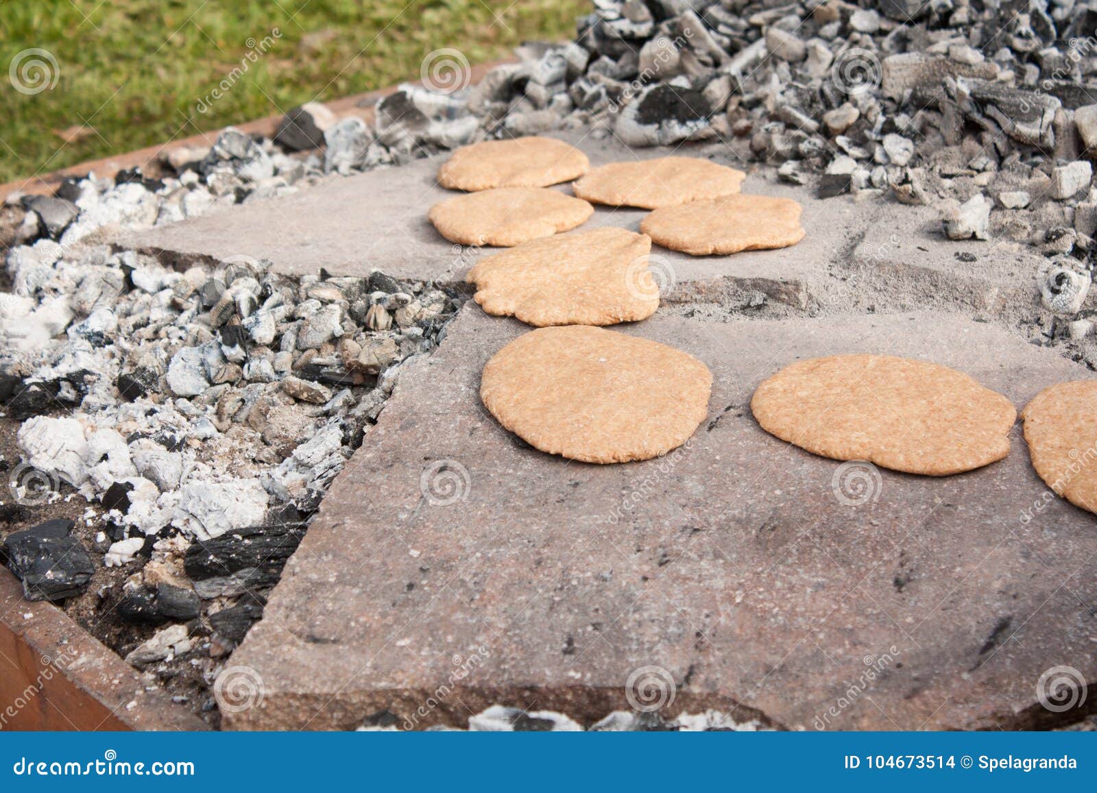 Baking Prehistoric Bread on Stones Stock Photo - Image of performed ...