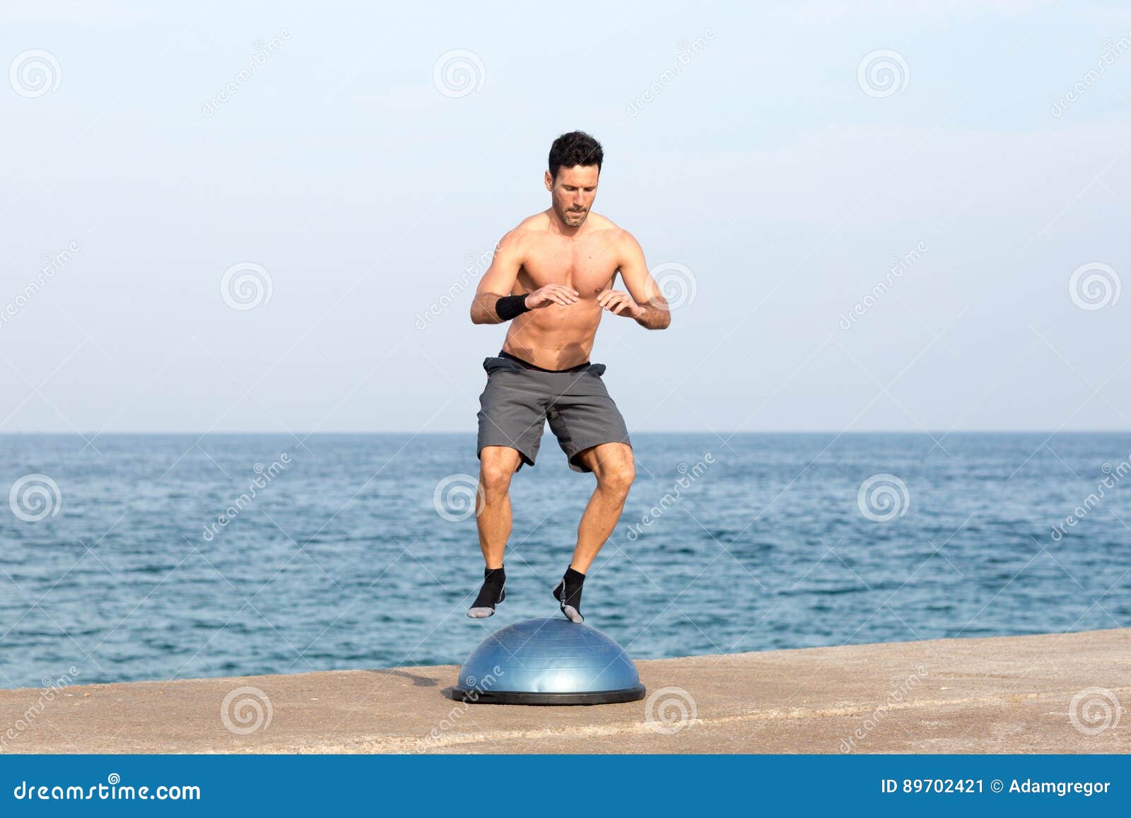 Balance Exercise on Platform with Coach by Sea Stock Image - Image of ...