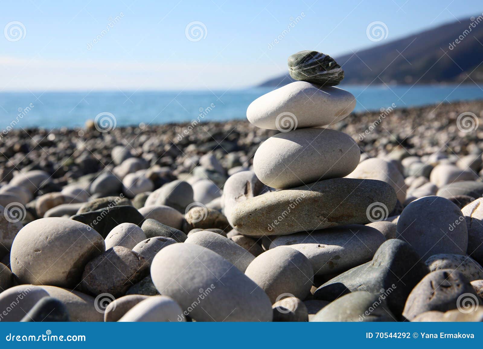 Balance Pebbles And Couple Legs On The Beach Royalty-Free Stock ...