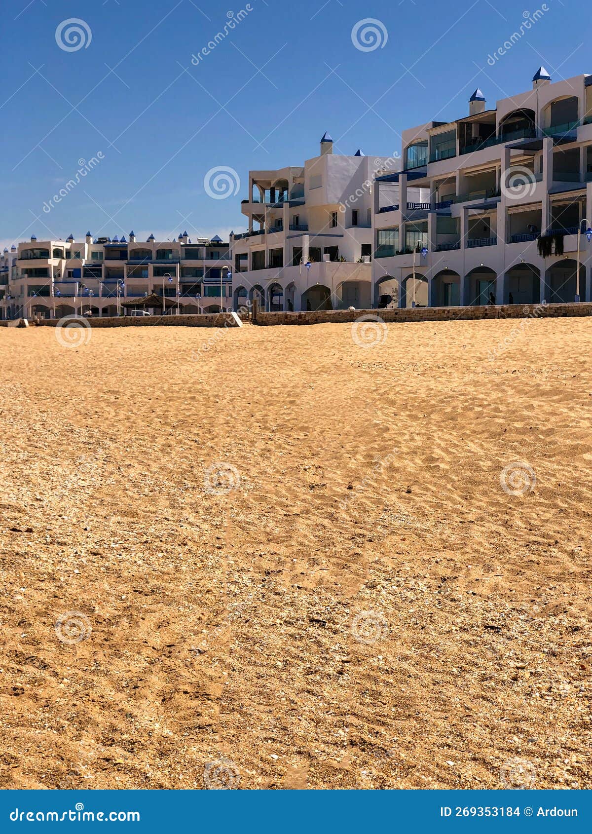 Balanced Beachscape a Harmonious Blend of Sand, Buildings, and Natural ...