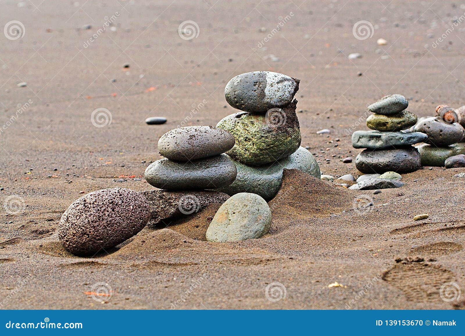 Balanced Stacked Stones or Pebbles on Black Volcanic Sand Stock Photo ...