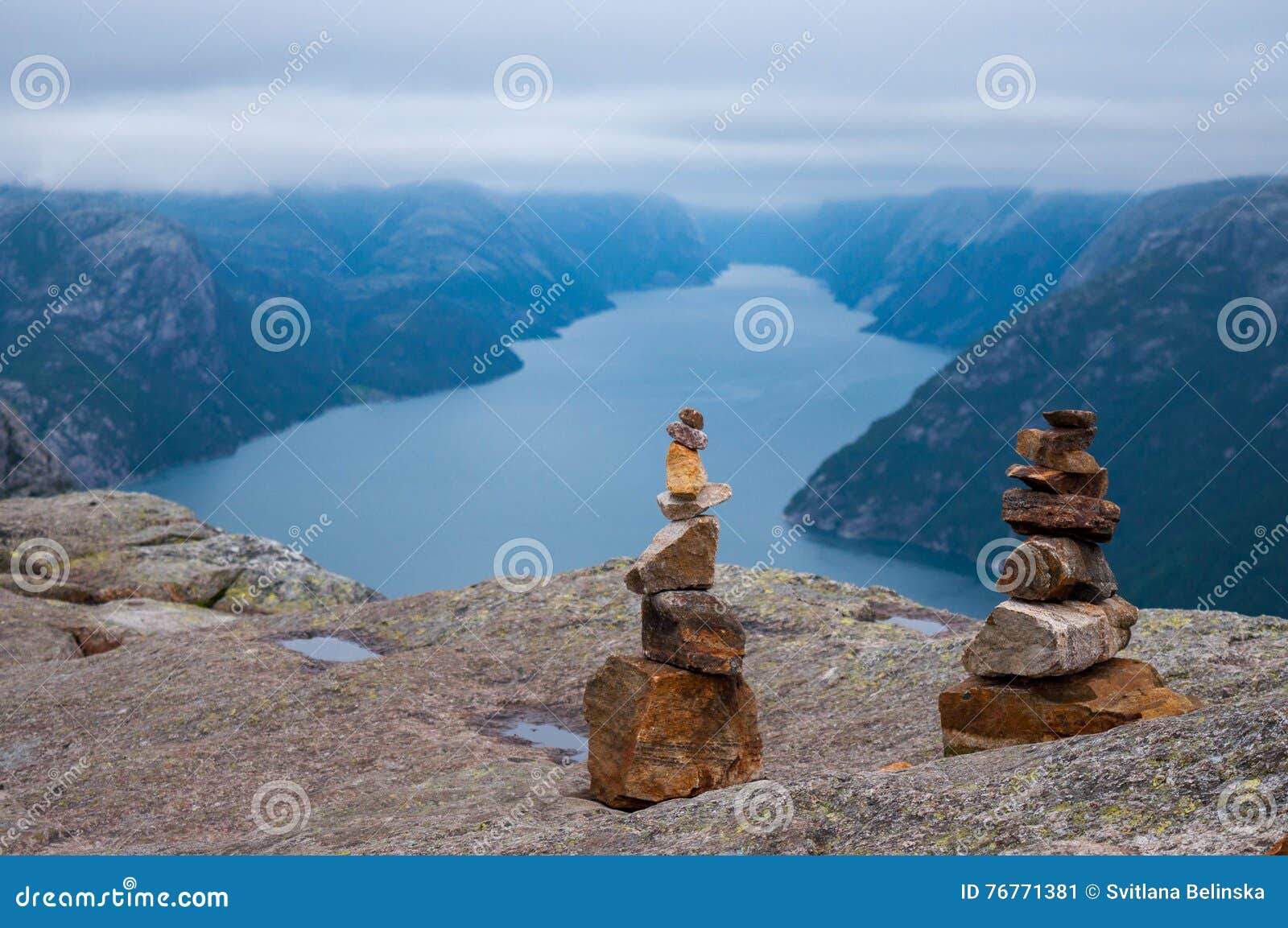 Balanced Stone Pyramide on Shore of Blue Water Stock Image - Image of ...