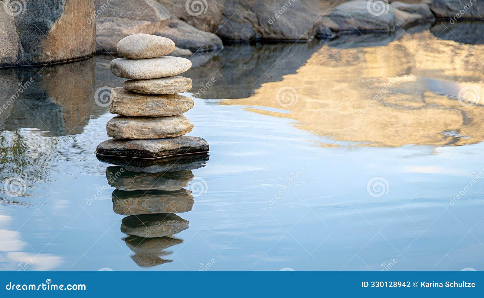 Balanced Stone Stacks on Tranquil Water Surface Reflect Stock ...