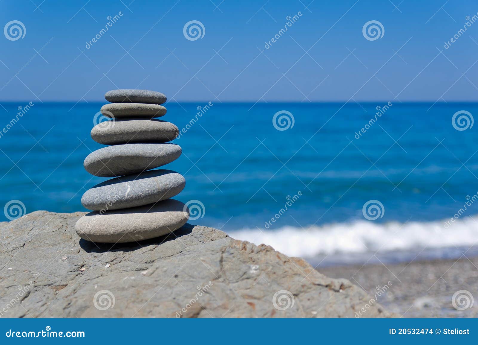 Balancing beach stones stock photo. Image of balance - 20532474