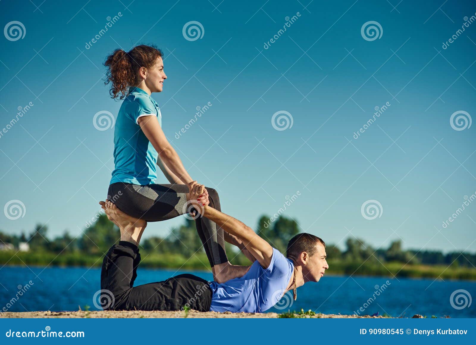 Balancing in pair stock image. Image of exercise, pose - 90980545