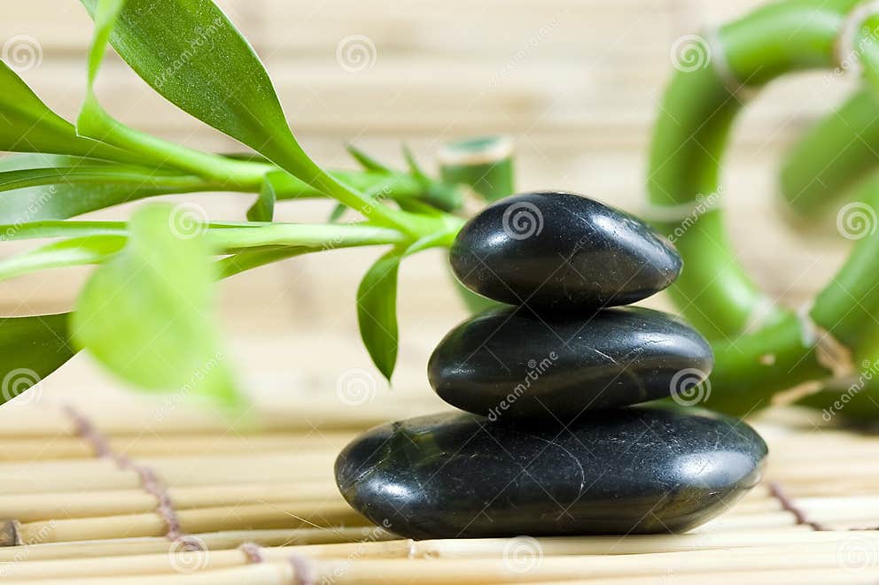 Balancing Pebbles with Bamboo Stock Photo - Image of nature, harmony ...