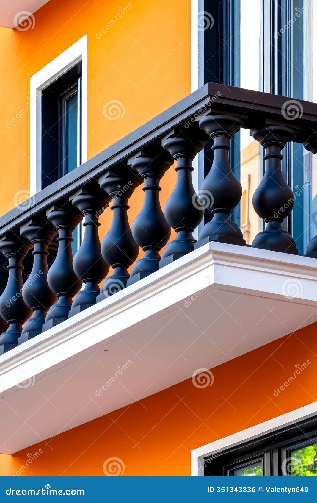 A Balcony with Black Balusters on an Orange Building Stock Photo ...
