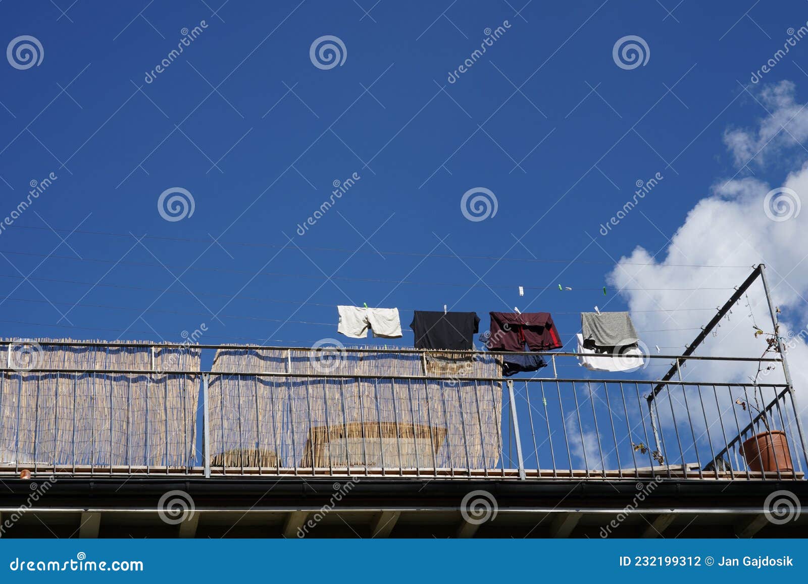 Balcony with Clothes Line with Some Pieces of Clothes Drying in the Sun ...