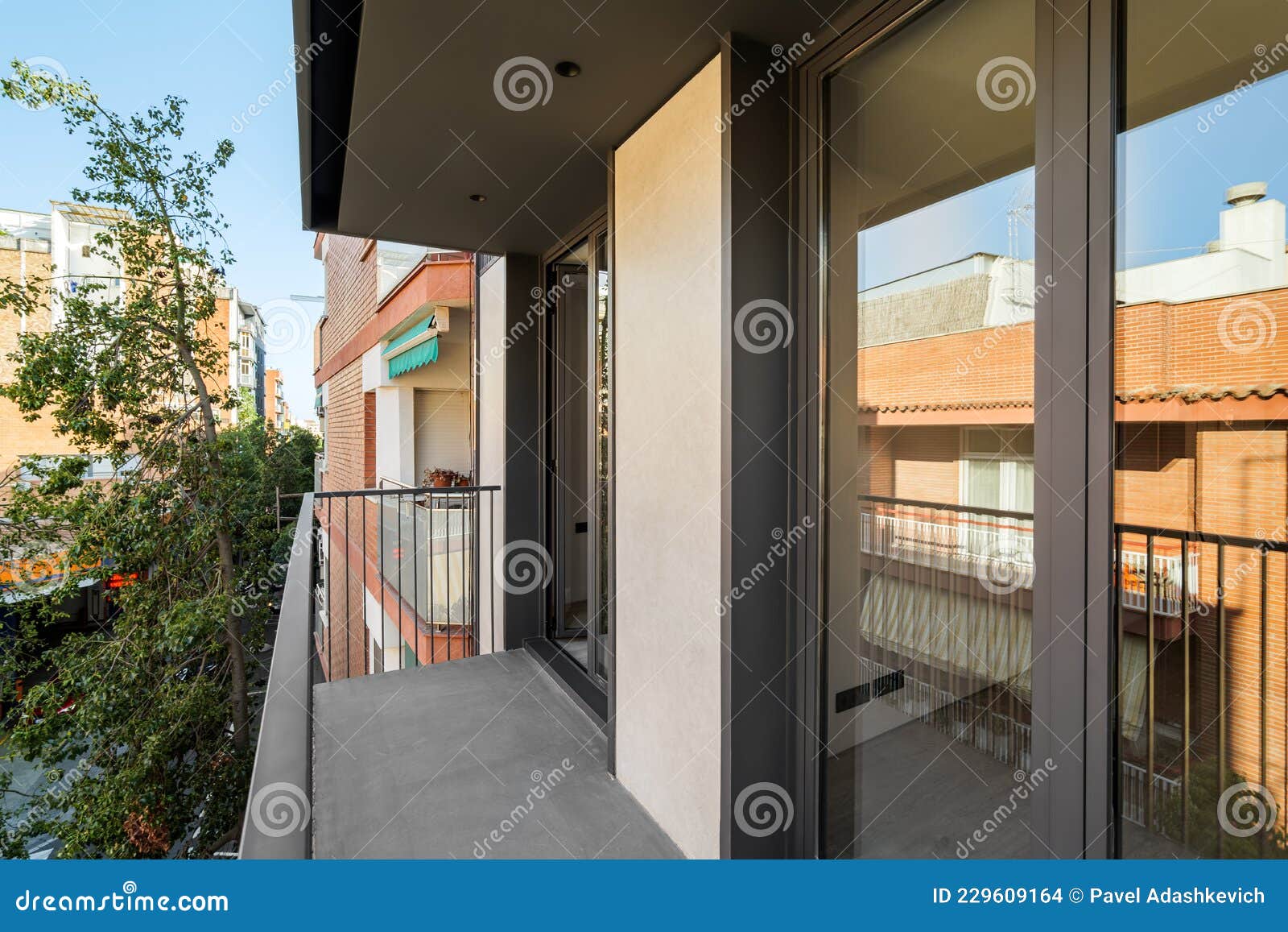 A Balcony in Modern Building of Barcelona with Reflection in Window ...