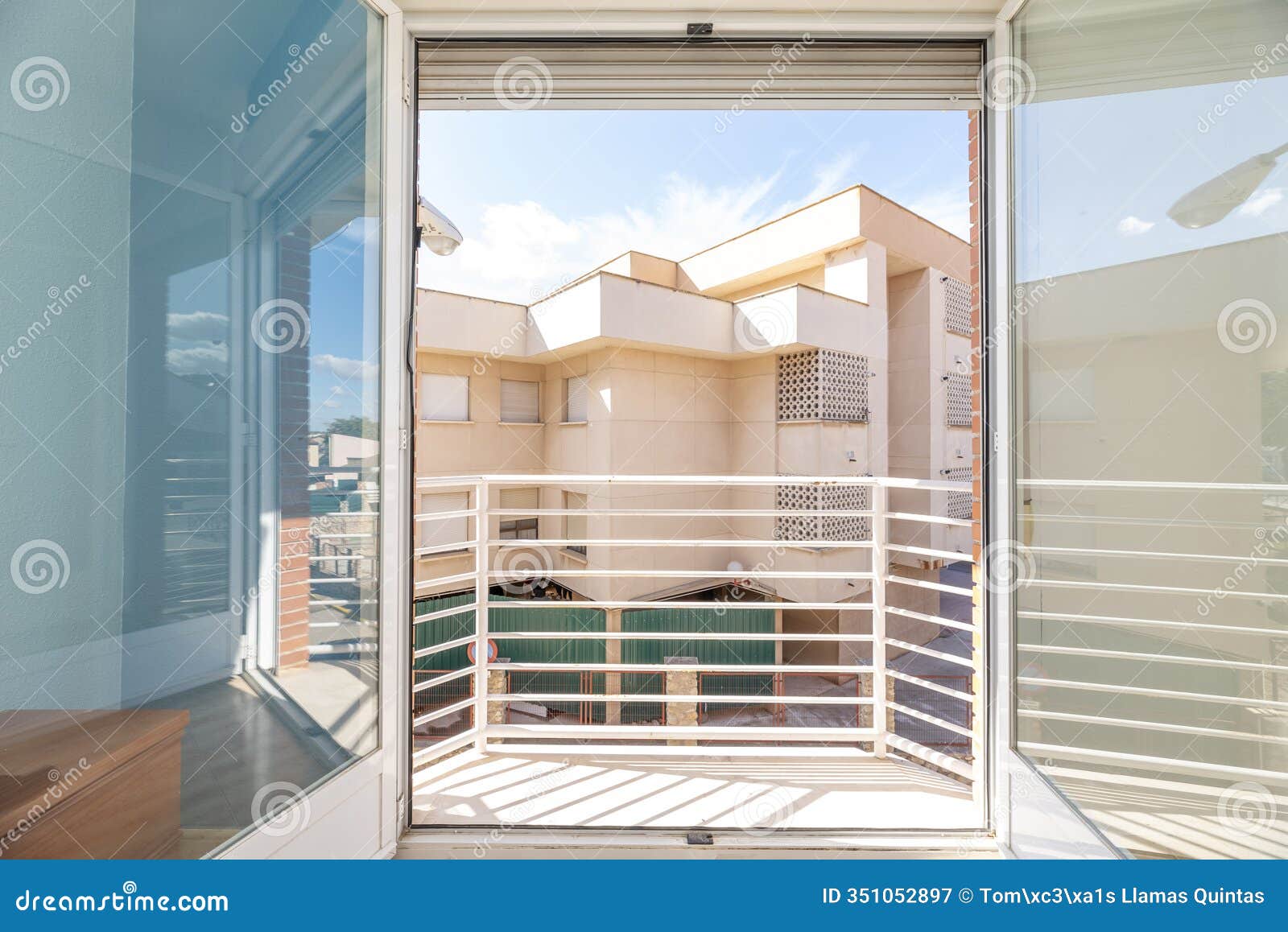 A Balcony Overlooking the Street and Two Folding Glass Doors Stock ...