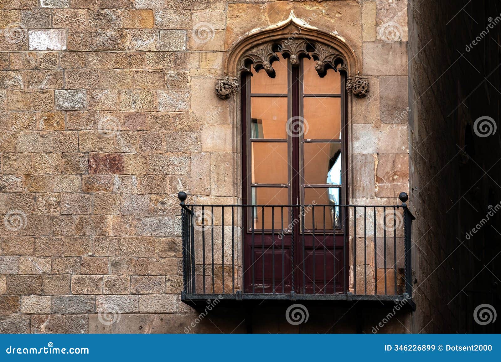 Balcony on a stone wall. stock image. Image of style - 346226899