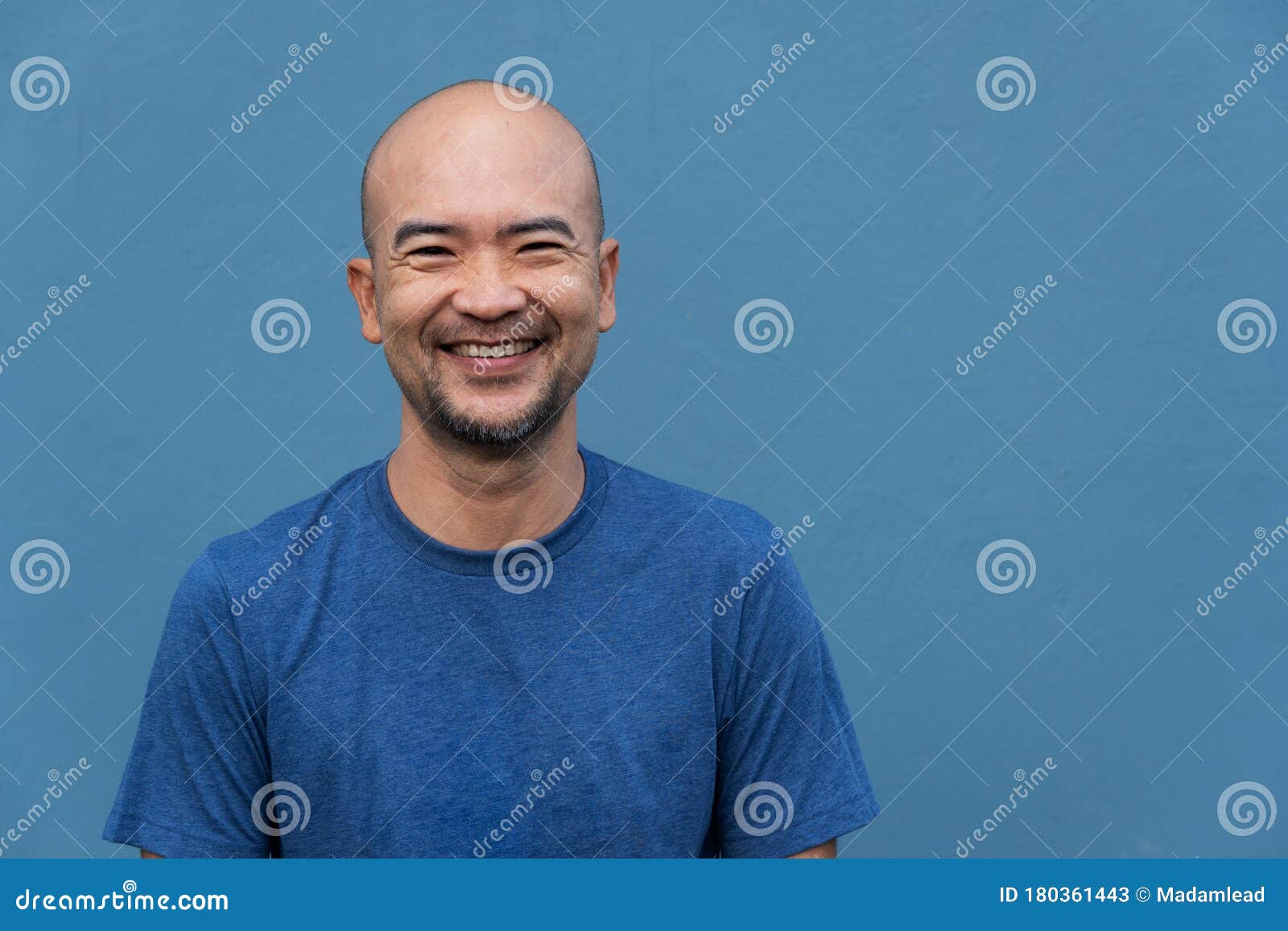 Bald Beard Smiling Japanese Portrait Man with T-shirt on Cement Blue ... Bald Beard Smiling Japanese Portrait Man with T-shirt on Cement Blue ...