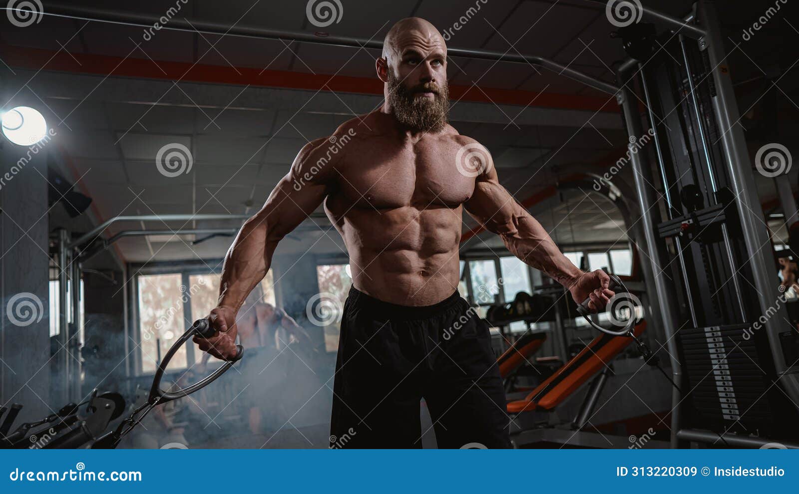 Bald Caucasian Bodybuilder Training Chest Using Cable Crossover in Gym ...
