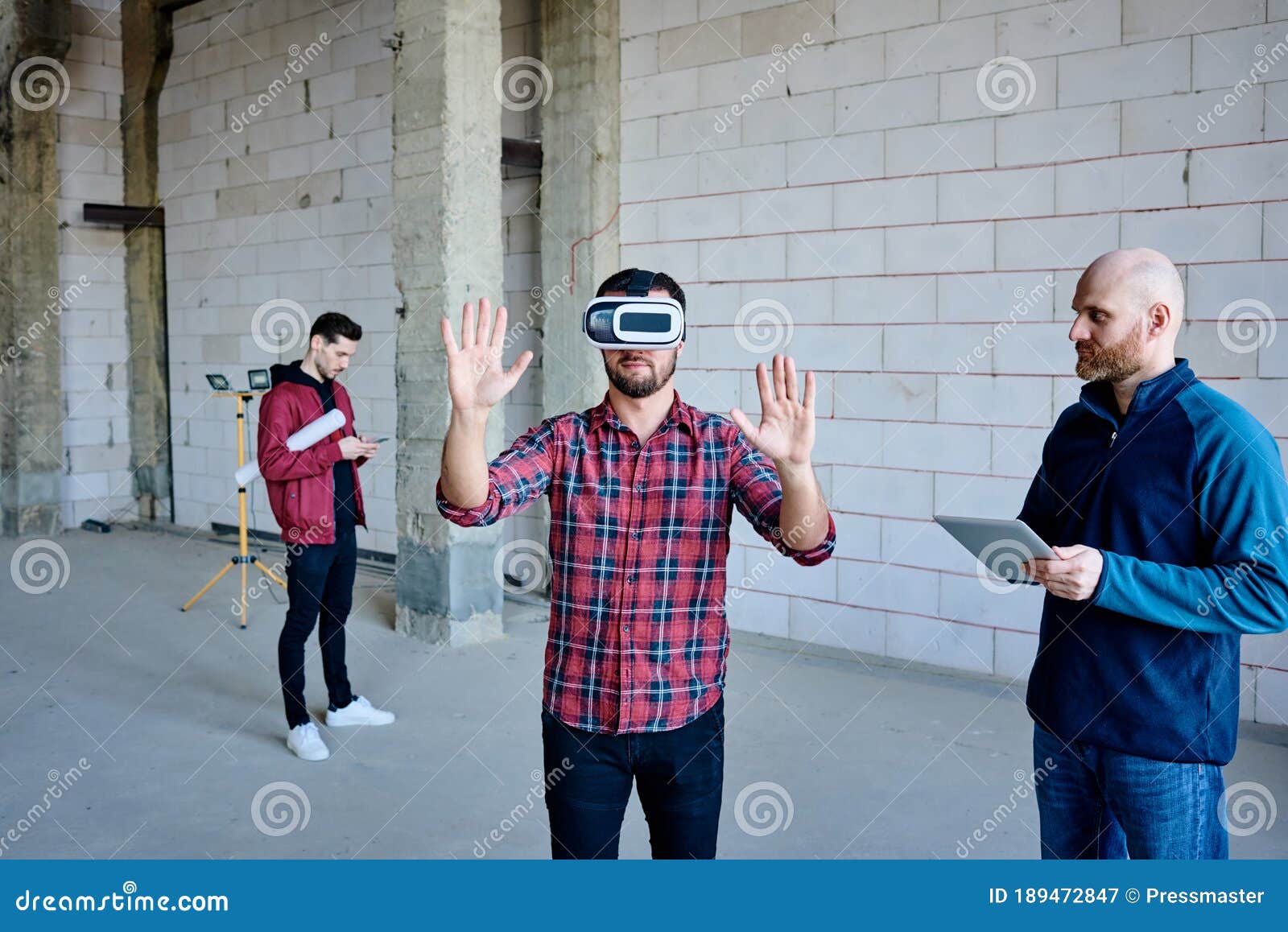 Bald Engineer Looking at His Colleague in Vr Headset Making ...
