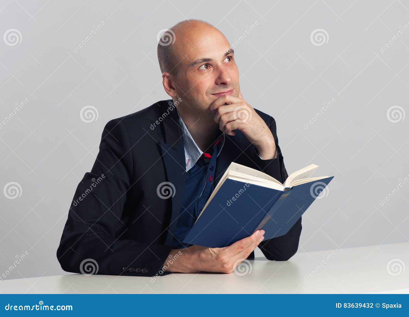 Bald guy reads a book stock photo. Image of read, looking - 83639432