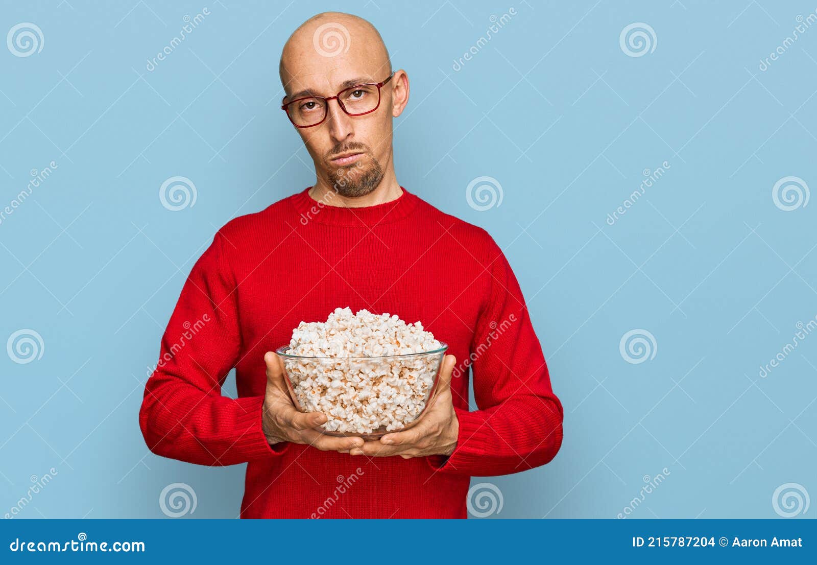 Bald Man with Beard Eating Popcorn Thinking Attitude and Sober ...