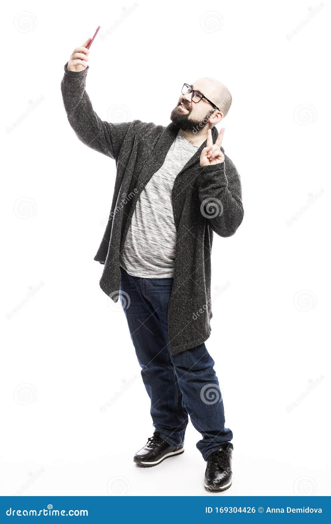 A Bald Man With Glasses And A Beard Takes A Selfie On The Phone Full