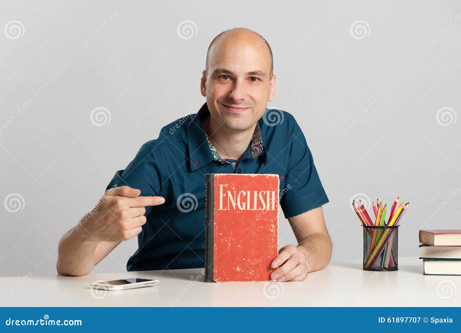Bald man learning English stock image. Image of caucasian - 61897707
