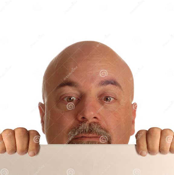 Bald man looking over sign stock image. Image of billboard - 6743239