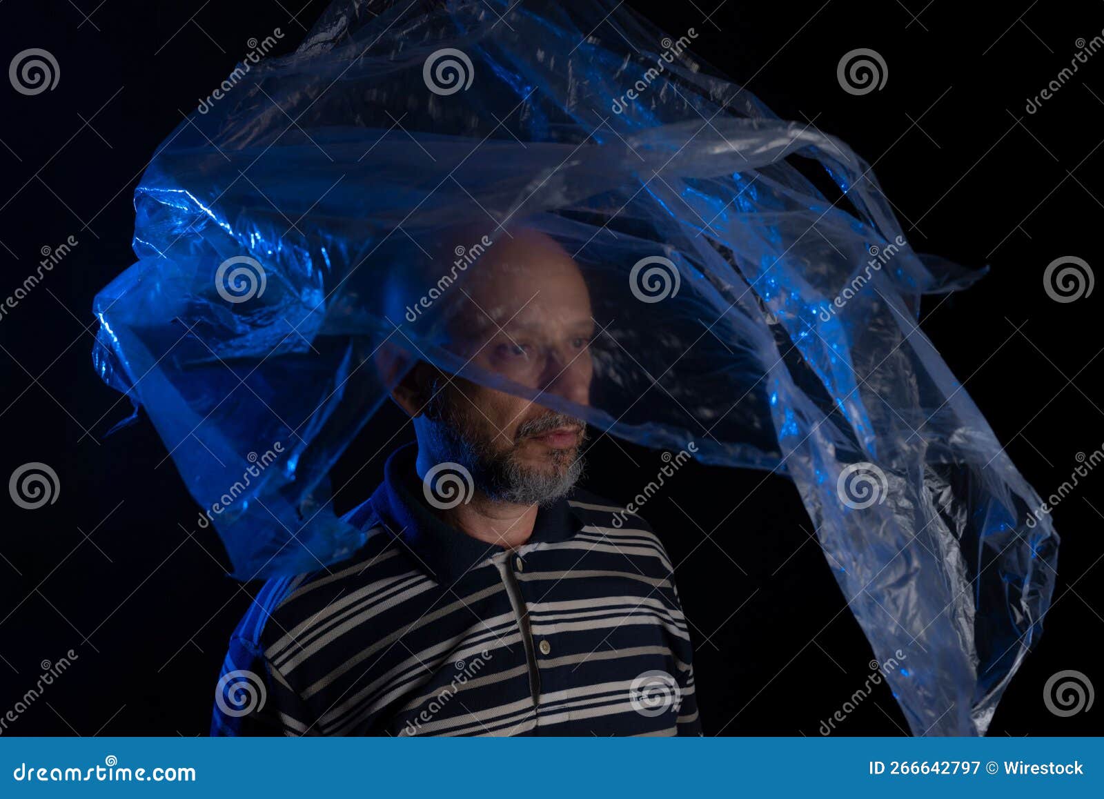 Bald Man Suffocating with a Transparent Plastic Bag Flying Over His ...