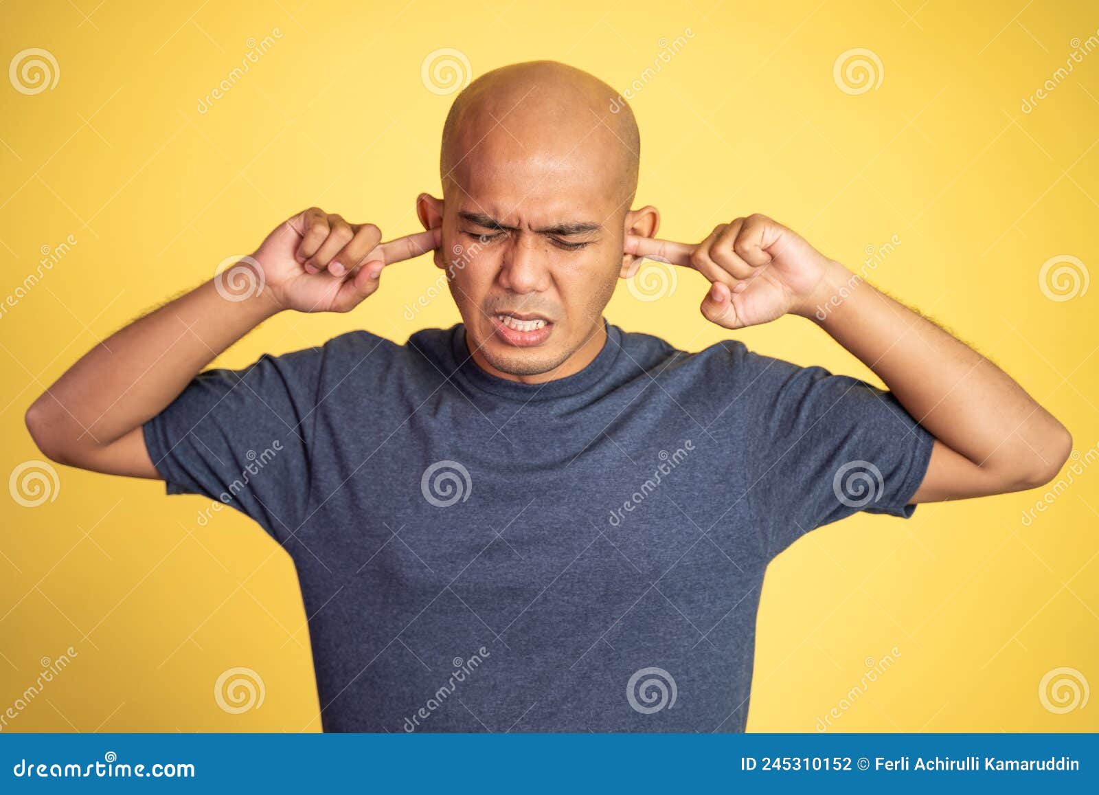 Bald Man with Uncomfortable Expression with Fingers Covering Ears Stock ...