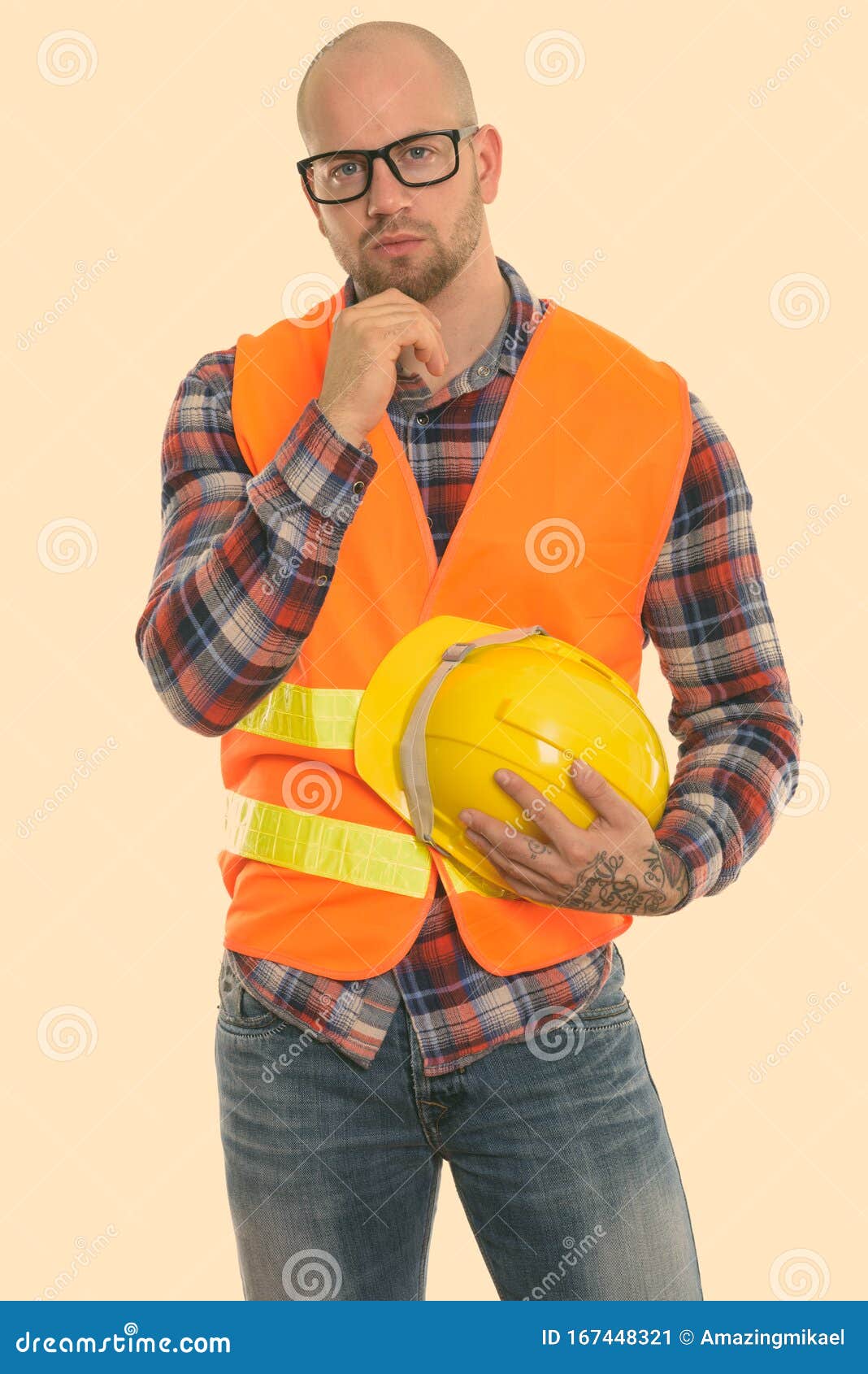 Bald Muscular Man Construction Worker Thinking while Holding Safety ...