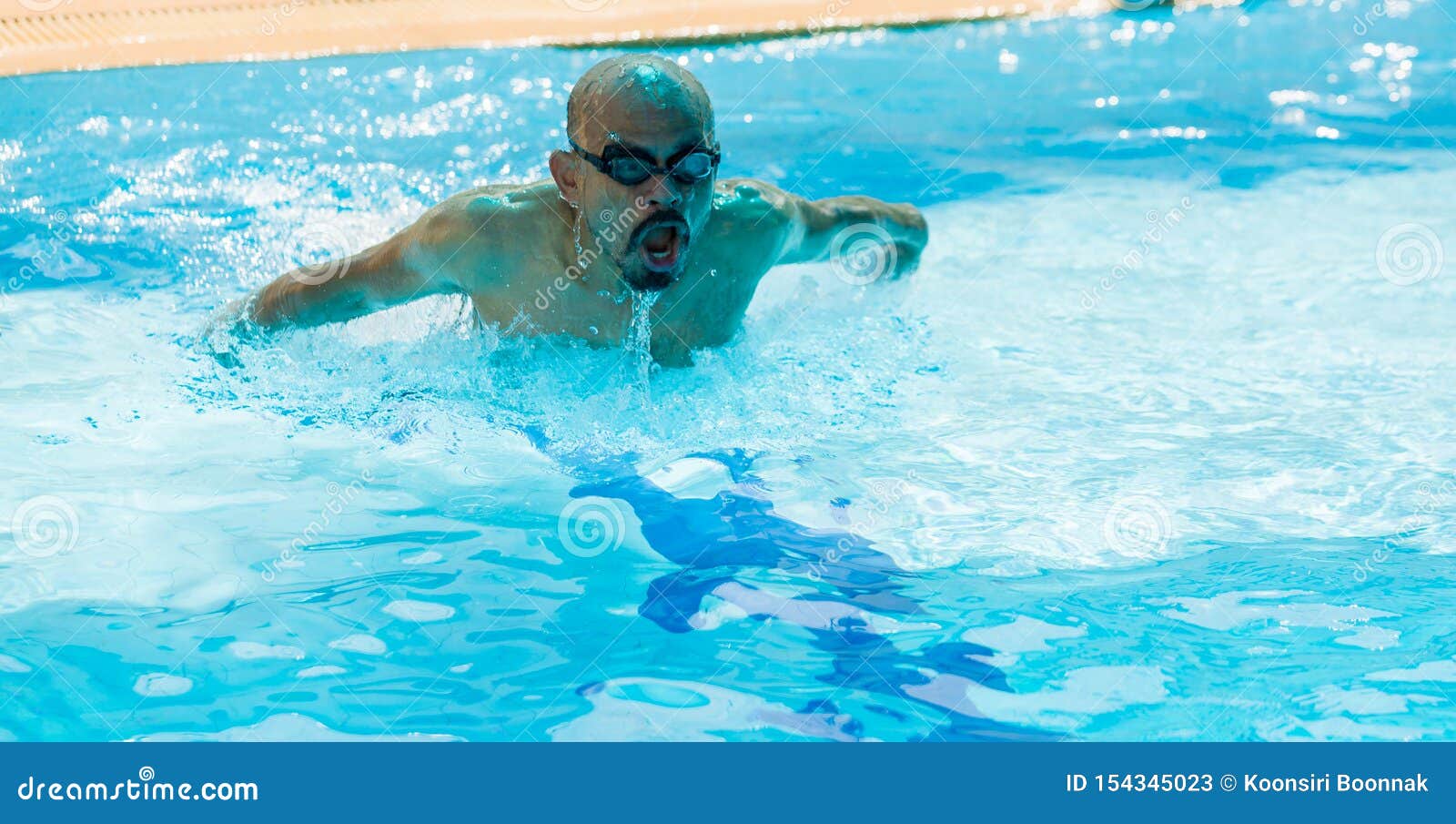 Bald and Mustache Man Swimming Breaststroke in the Pool. Swimmer is ...