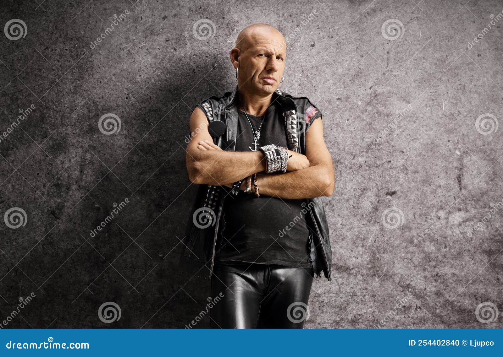 Bald Punk Leaning on a Rusty Wall Stock Photo - Image of cool, person ...